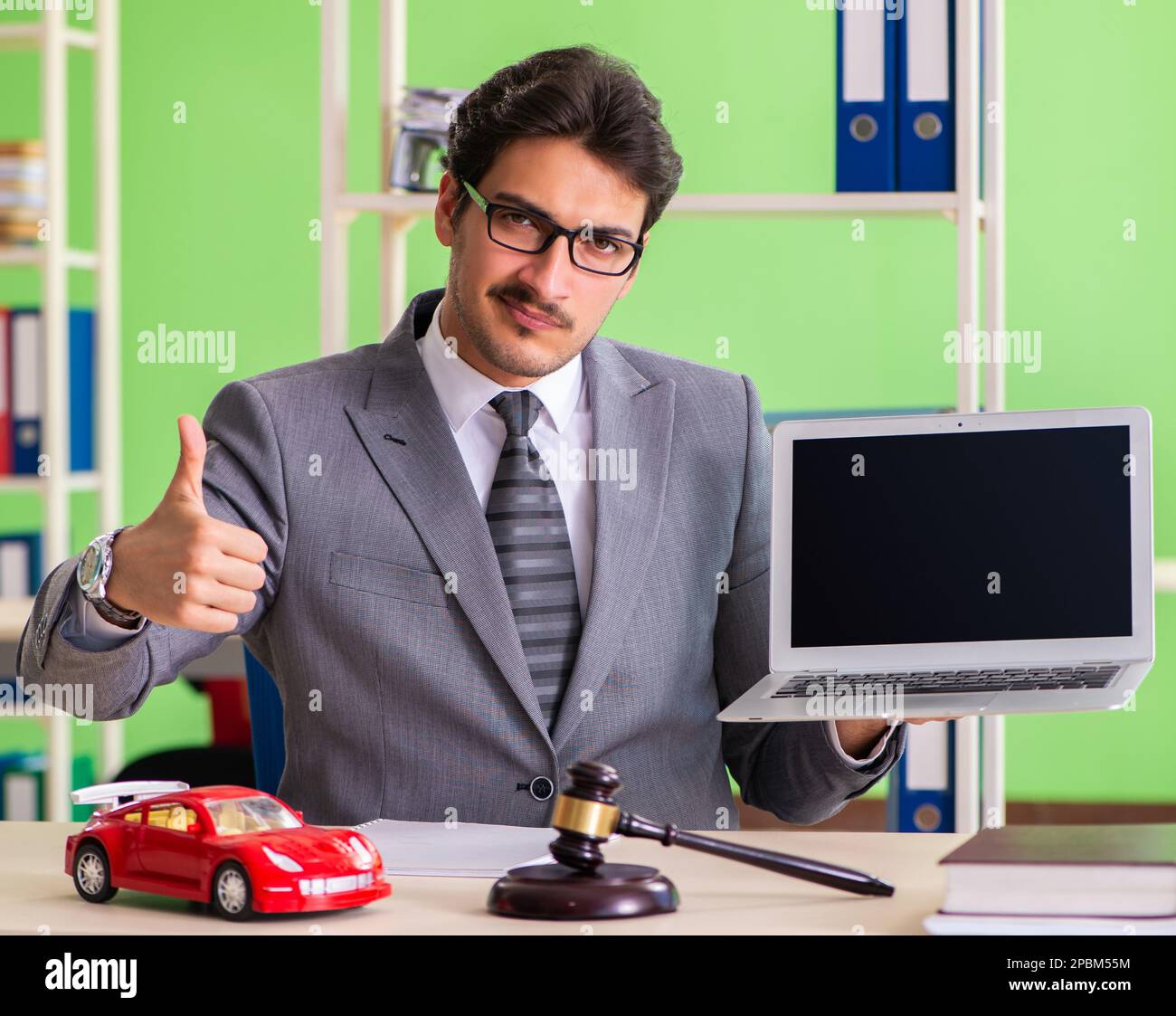 The young handsome lawyer working in the office Stock Photo - Alamy