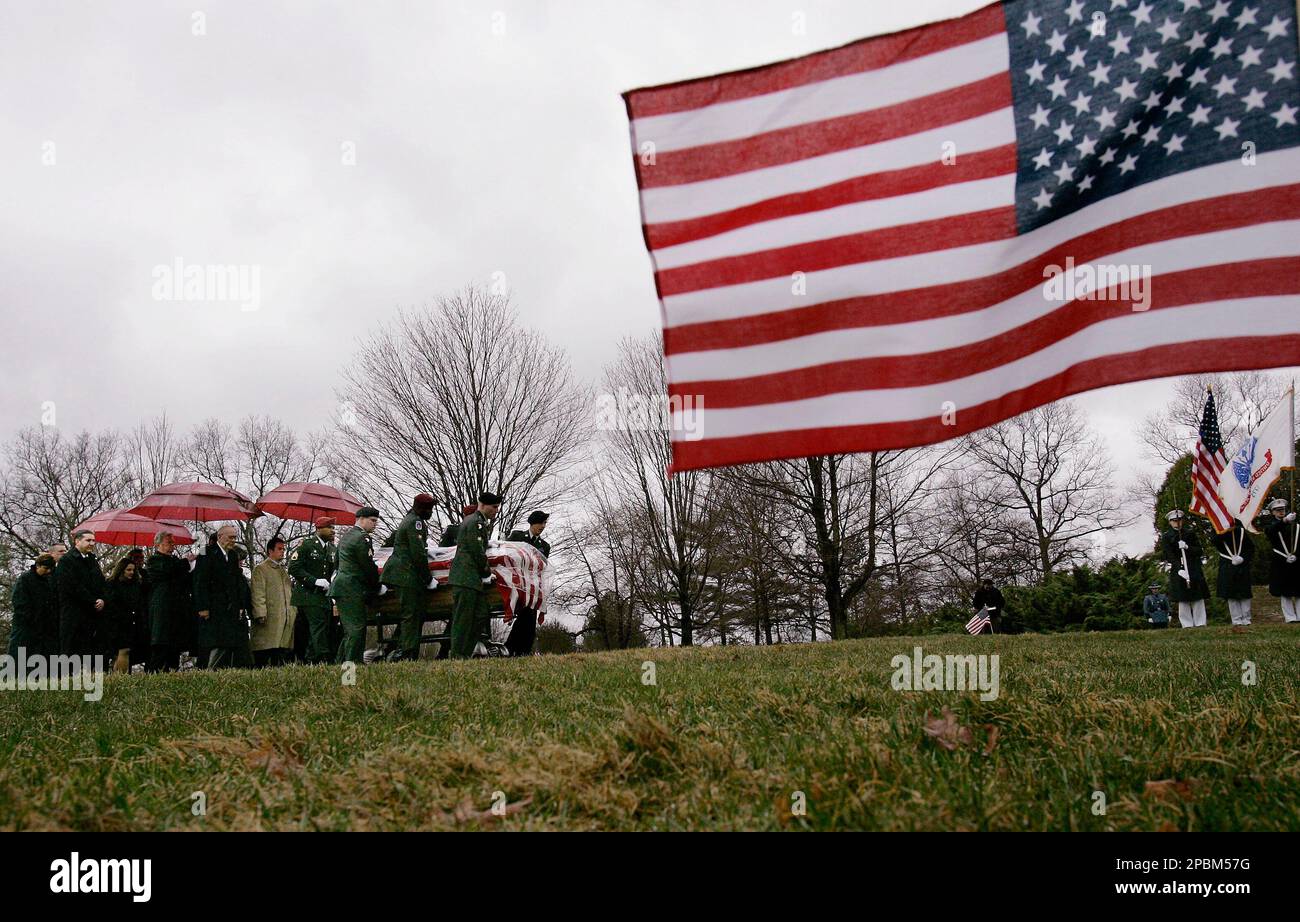 Escorted by an Army honor guard and followed by family members, the ...