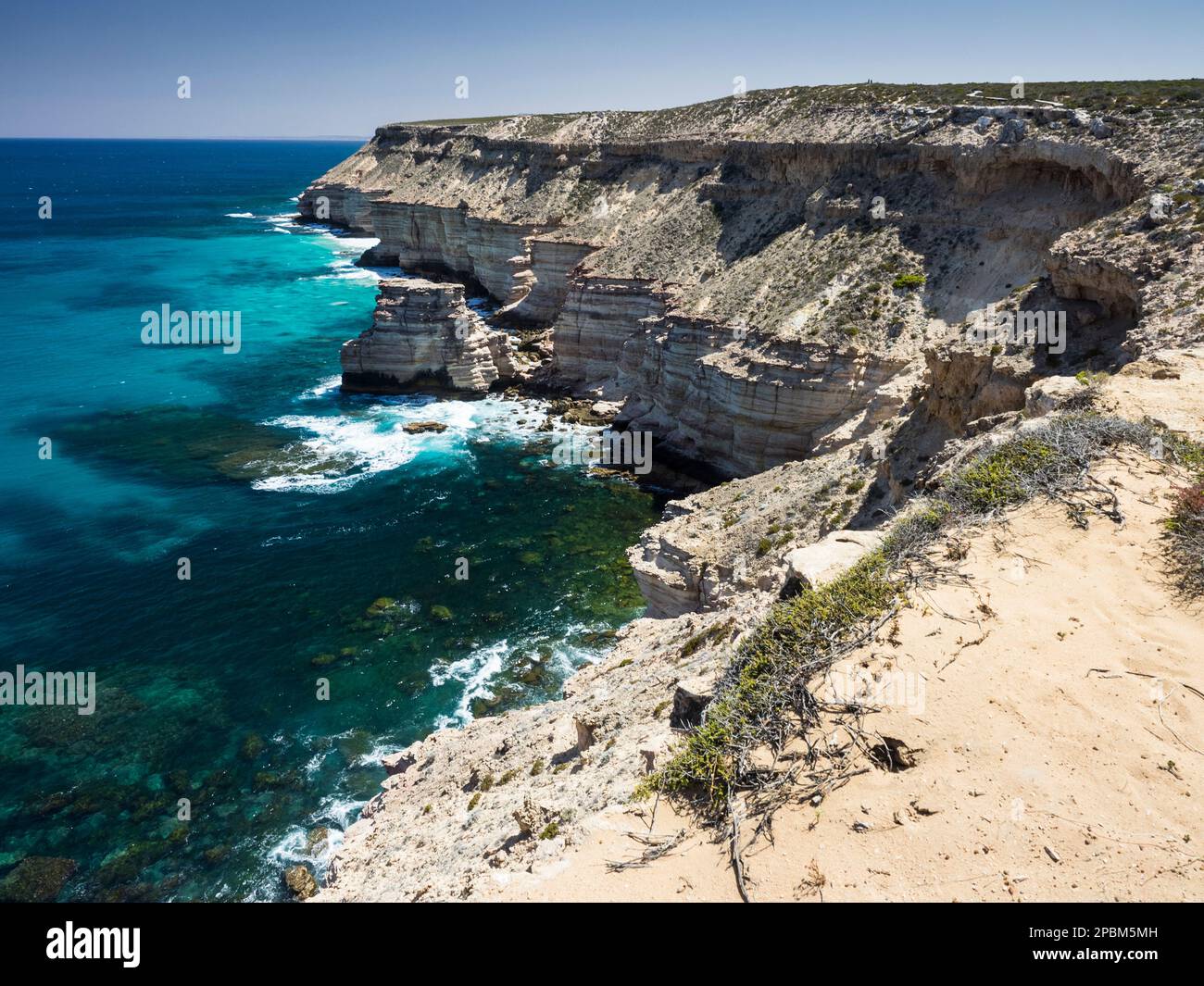 Island Rock and crumbling limestone clifftops above the relentless ...