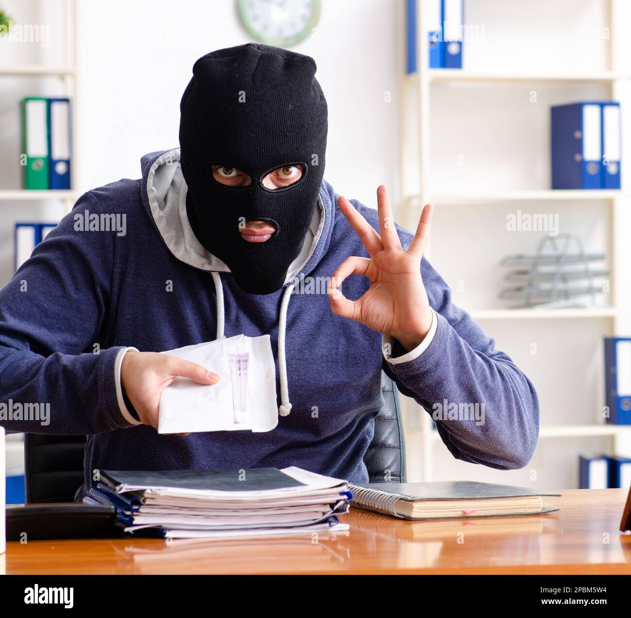 The male thief in balaclava in the office Stock Photo - Alamy