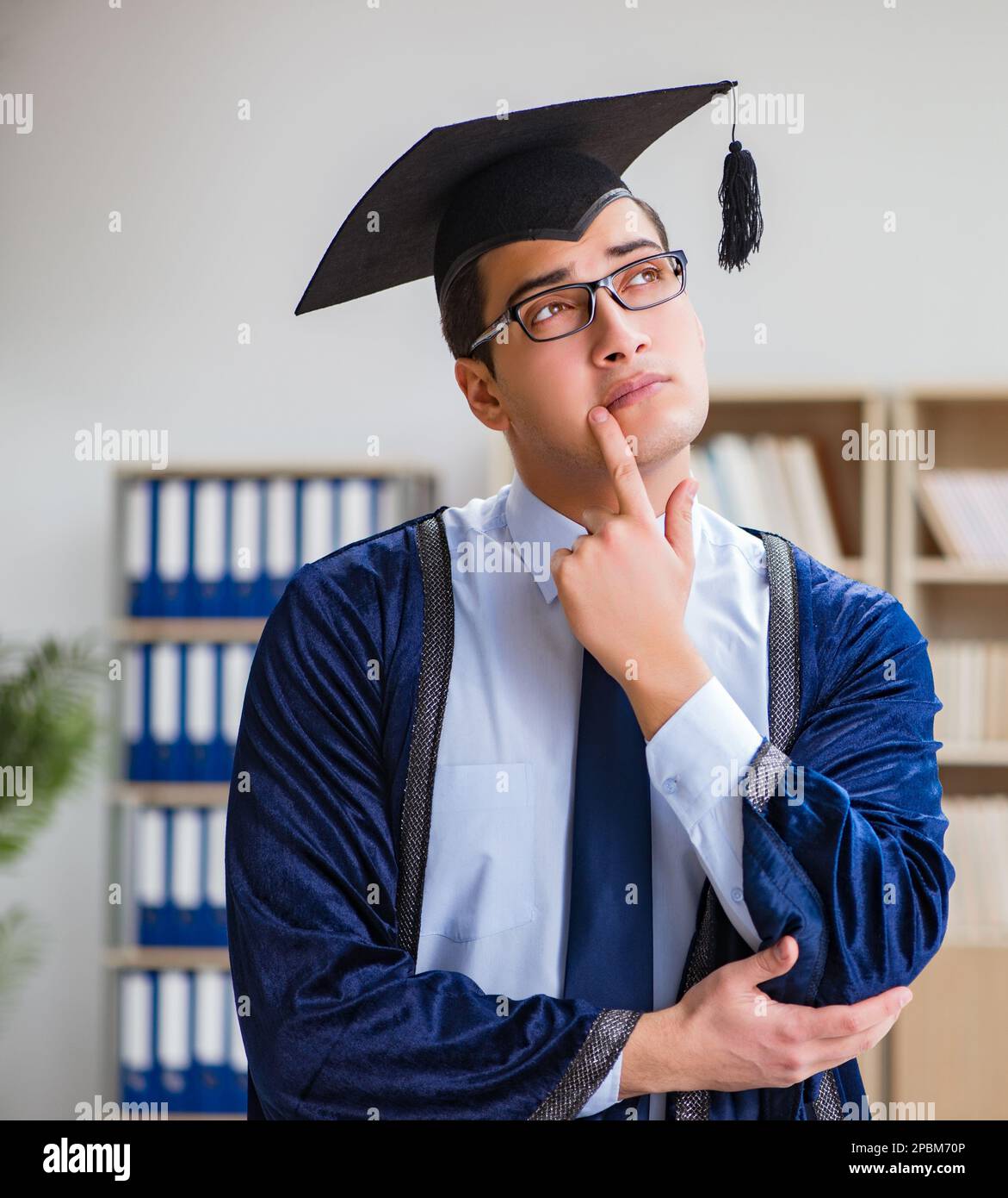 The young man graduating from university Stock Photo - Alamy