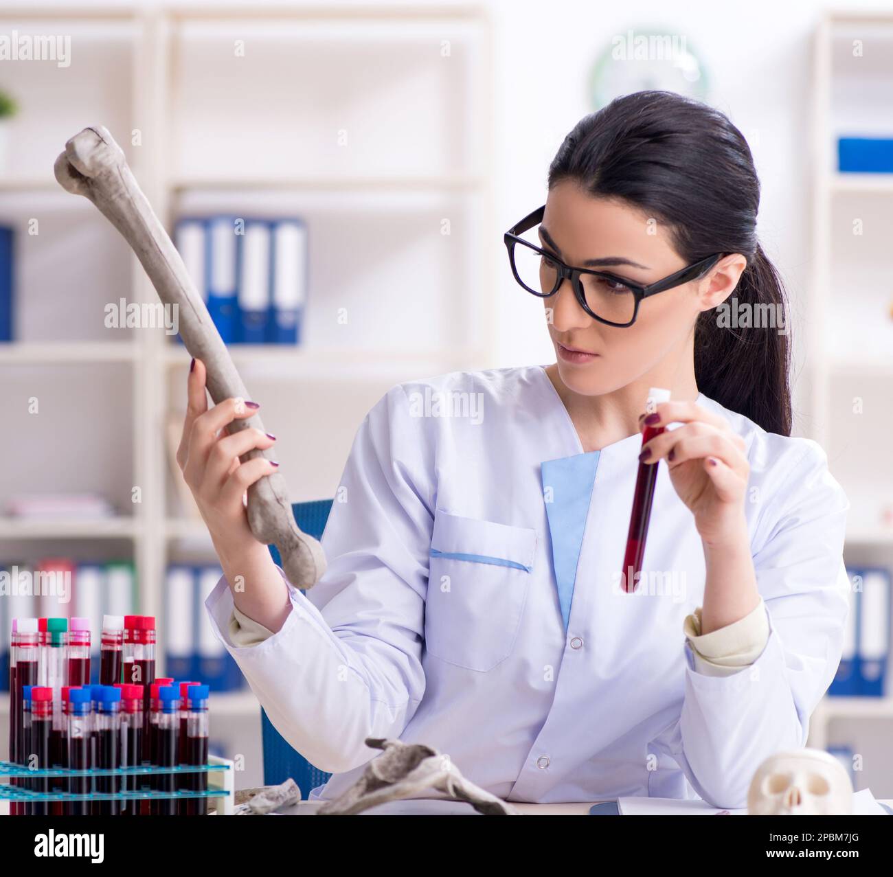 The young female archaeologist working in the lab Stock Photo - Alamy