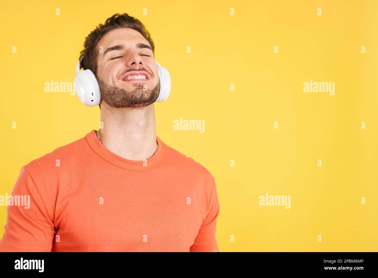 Relaxed caucasian man listening to music with headphones Stock Photo ...