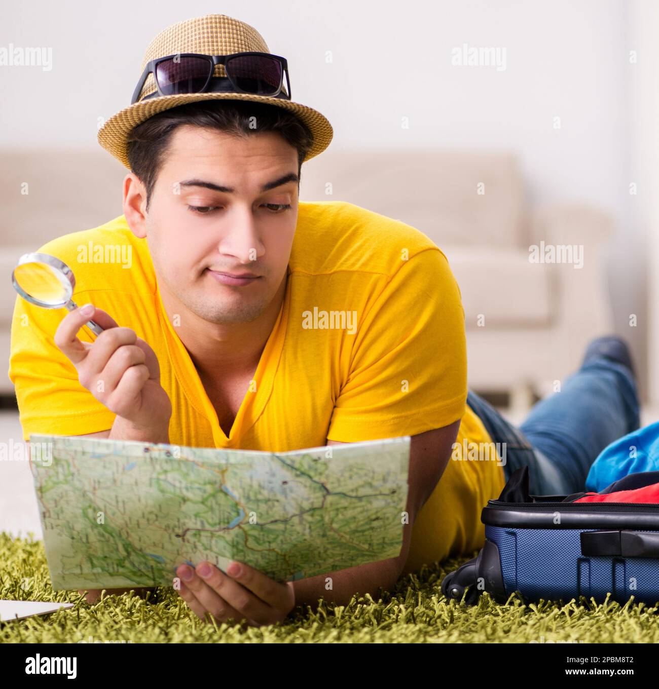 The man planning his vacation trip with map Stock Photo - Alamy