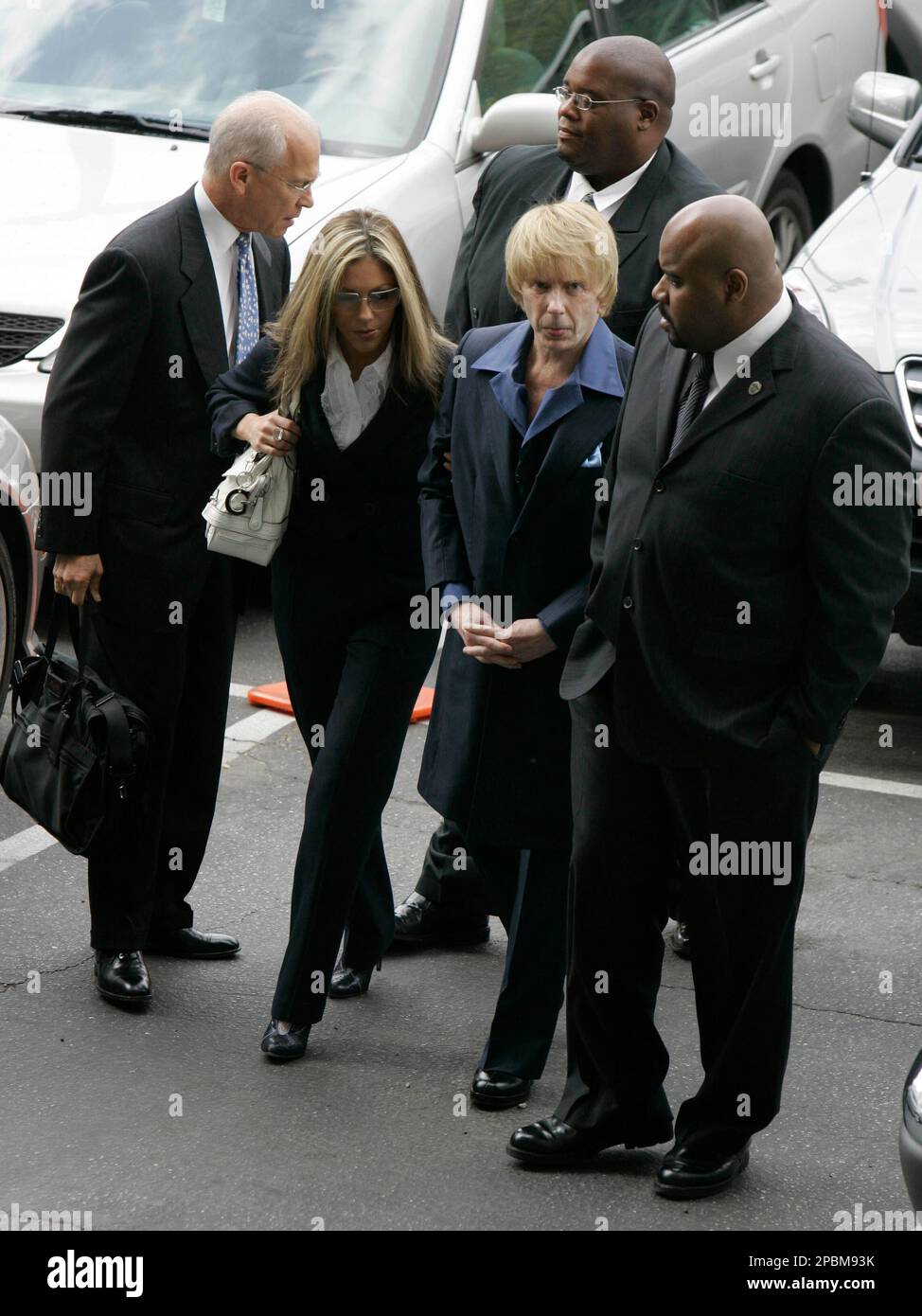 Phil Spector, center, with his wife, Rachelle Short, his attorney ...