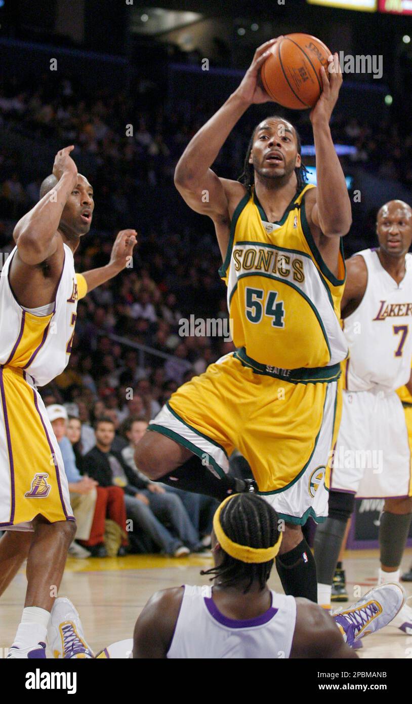 Seattle Supersonics' Chris Wilcox (54) knocks over Los Angeles Lakers ...