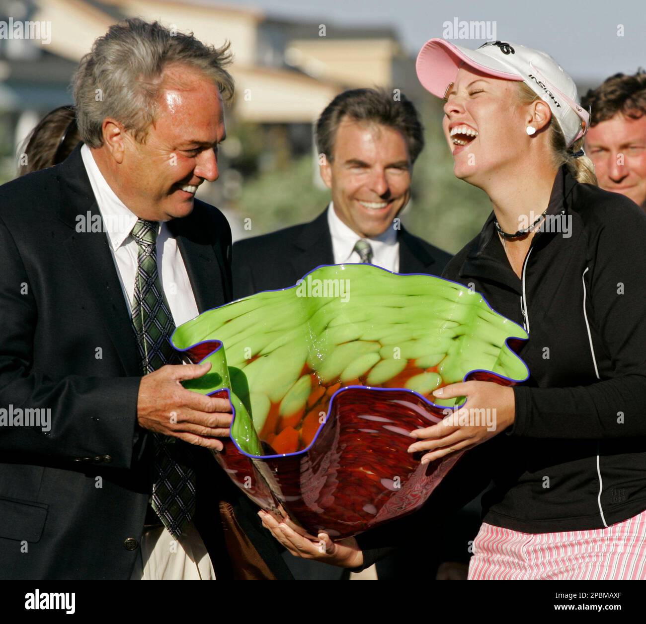 Bobby Ginn, left, CEO of the Ginn company awards Brittany Lincicome the ...