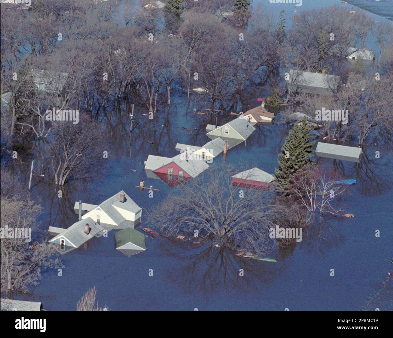** FILE ** Flood waters of the rising Red River submerges homes ...