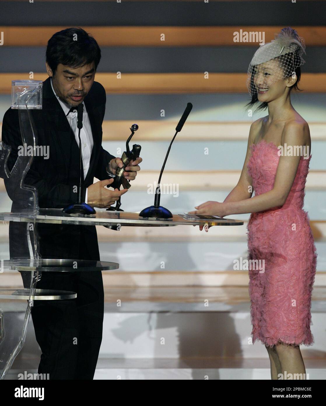 Hong Kong actor Lau Ching Wan receives his trophy for the Best Actor ...