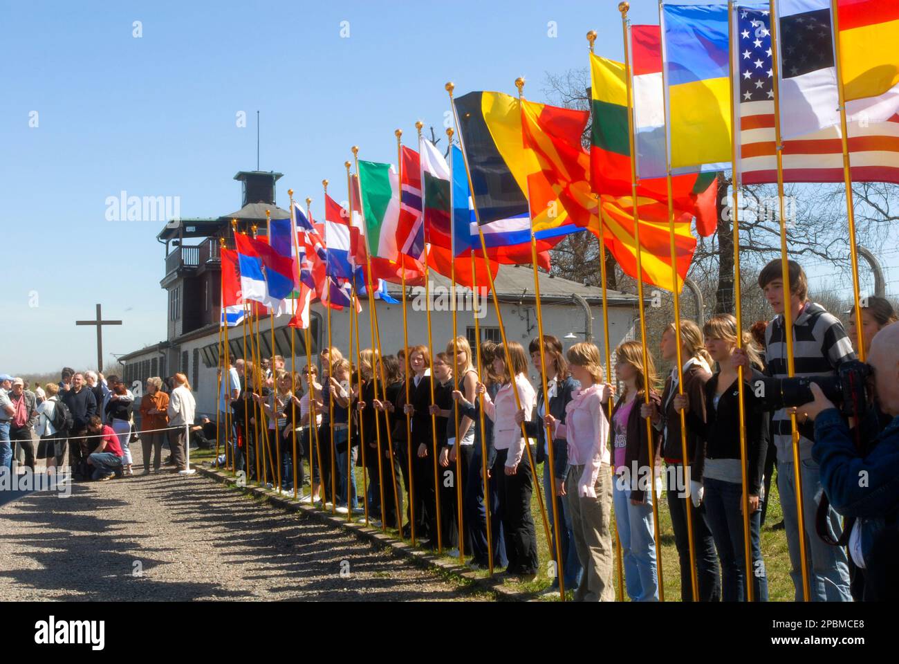 Participants holding flags are seen at a remembrance day event to mark ...