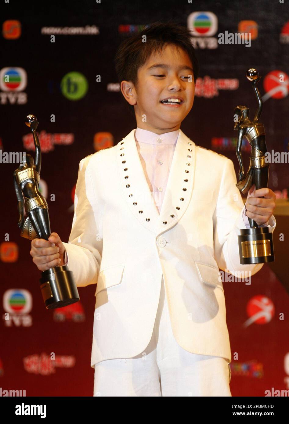 Malaysian actor Gouw Ian Iskandar, raises his two trophies for the Best ...