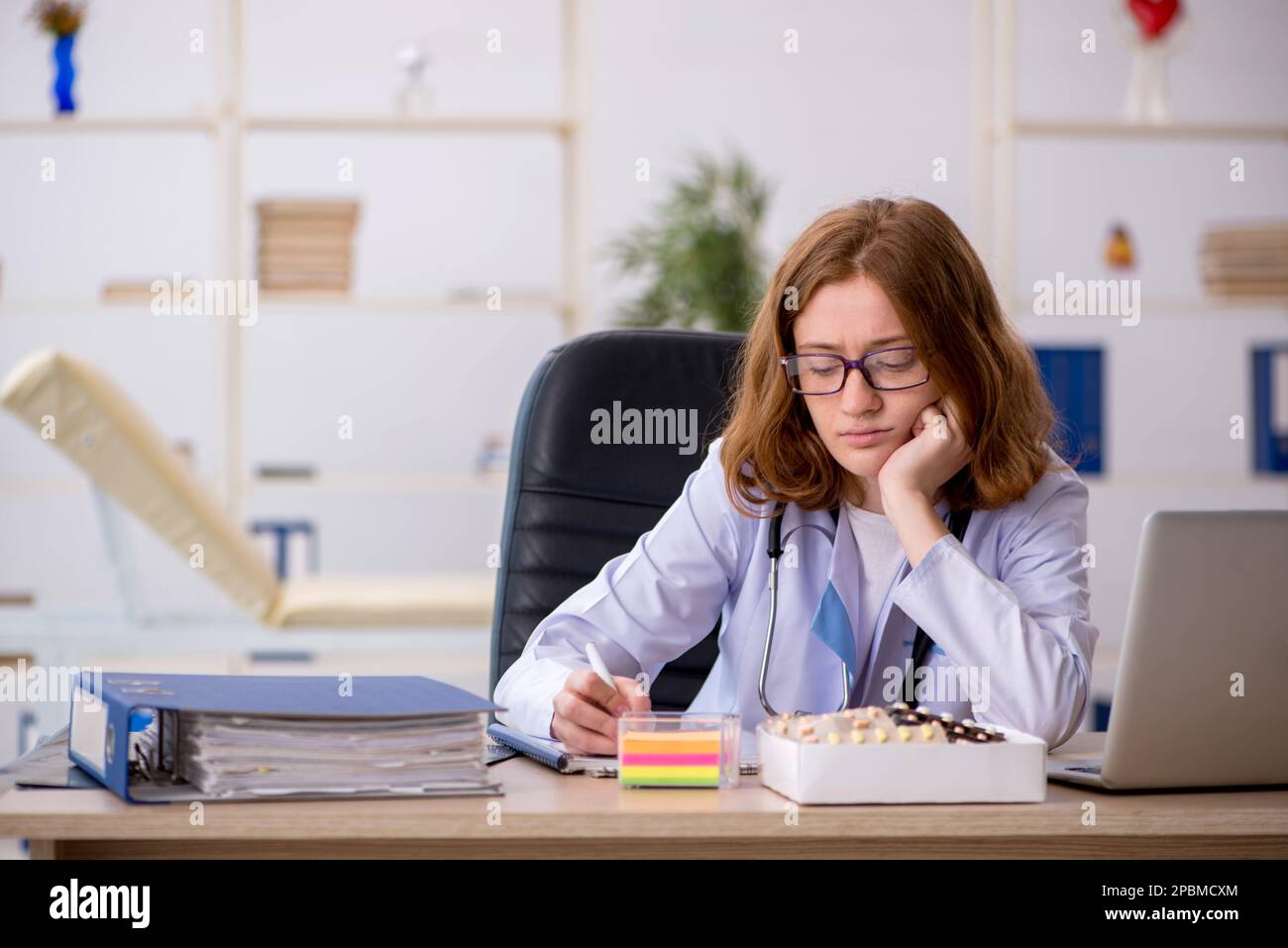 Young female doctor working at the hospital Stock Photo - Alamy