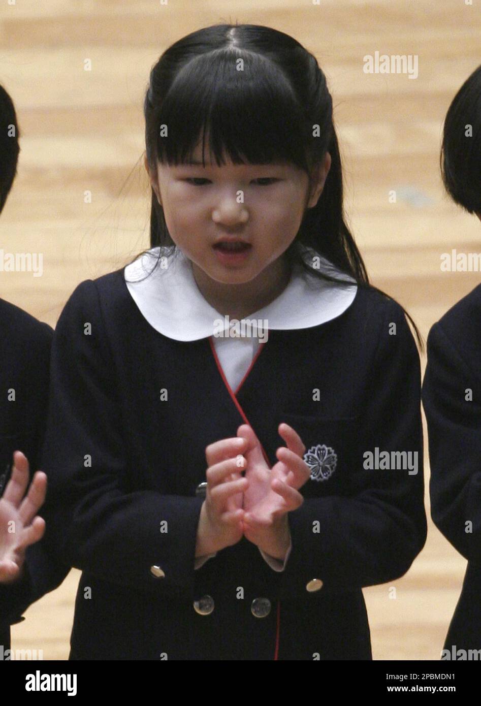Japan's Princess Aiko performs during a concert, watched by her parents ...