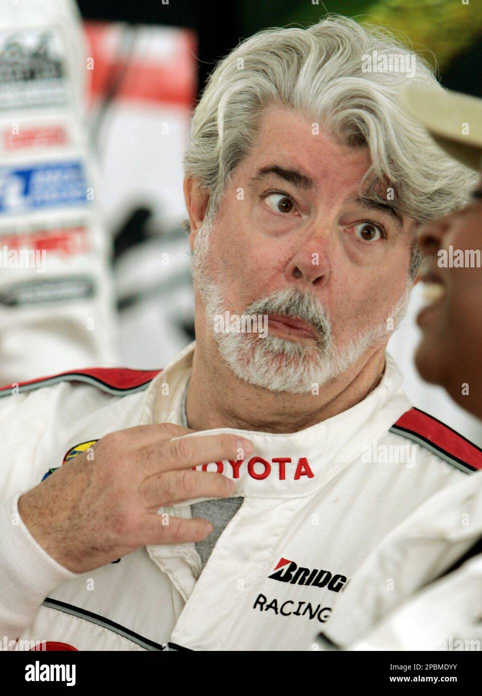 Movie magnate George Lucas talks in the paddock before the Toyota Pro ...