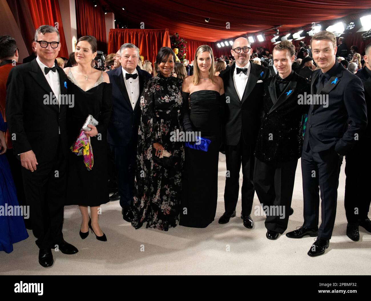 Ted Sarandos, third from left, Nicole Avant, and cast, crew and guests ...