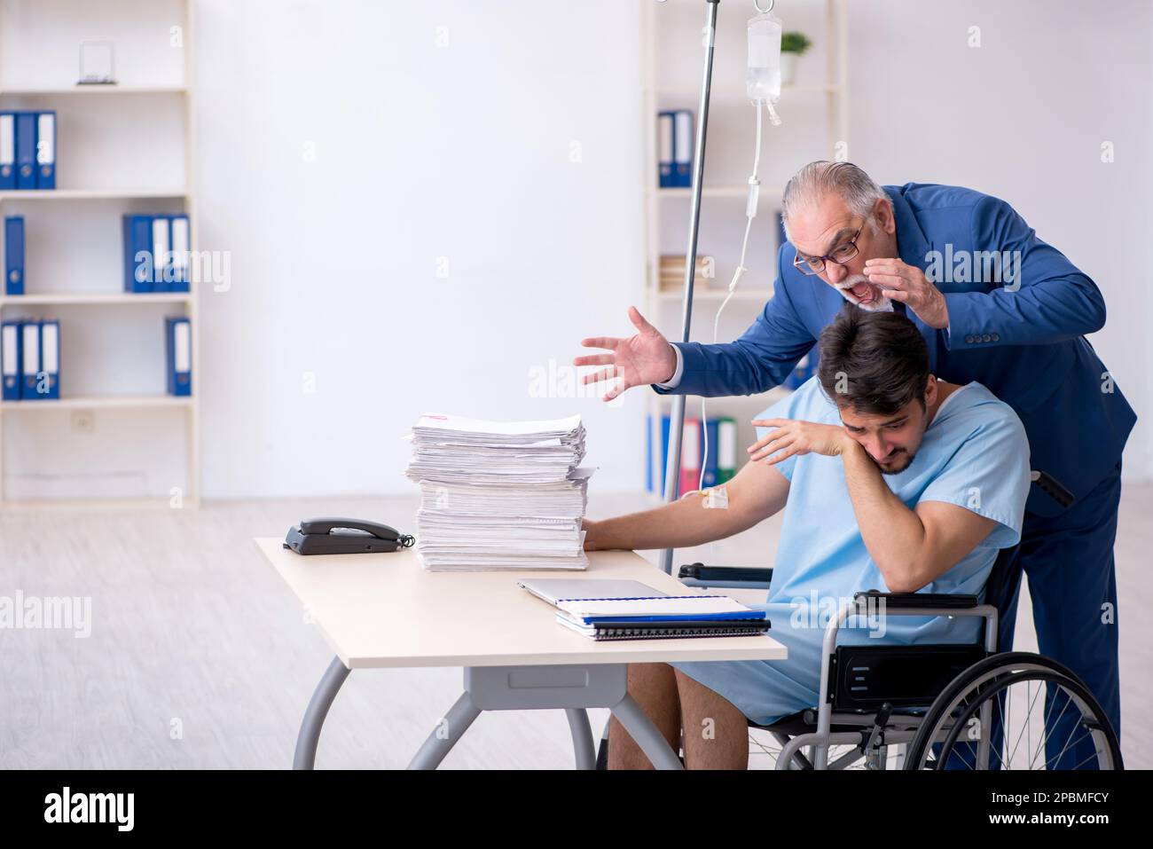 Young employee in wheel-chair feeling bad at workplace Stock Photo - Alamy
