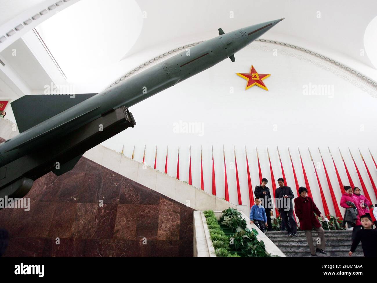 ** FILE ** Visitors walk past a Chinese-made anti-aircraft missile at ...