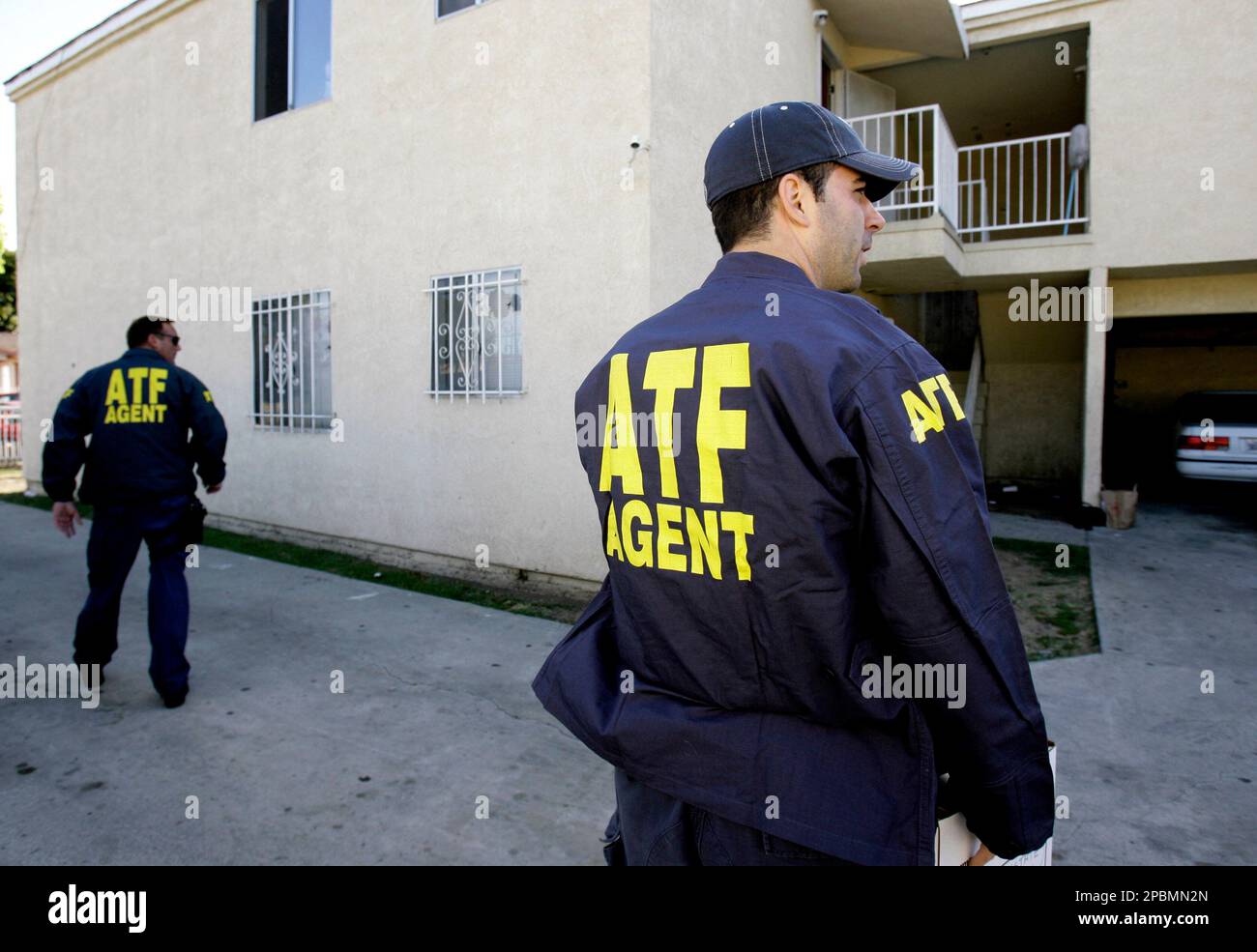 Alcohol, Tobacco and Firearms (ATF) officers inspect the grounds of an ...