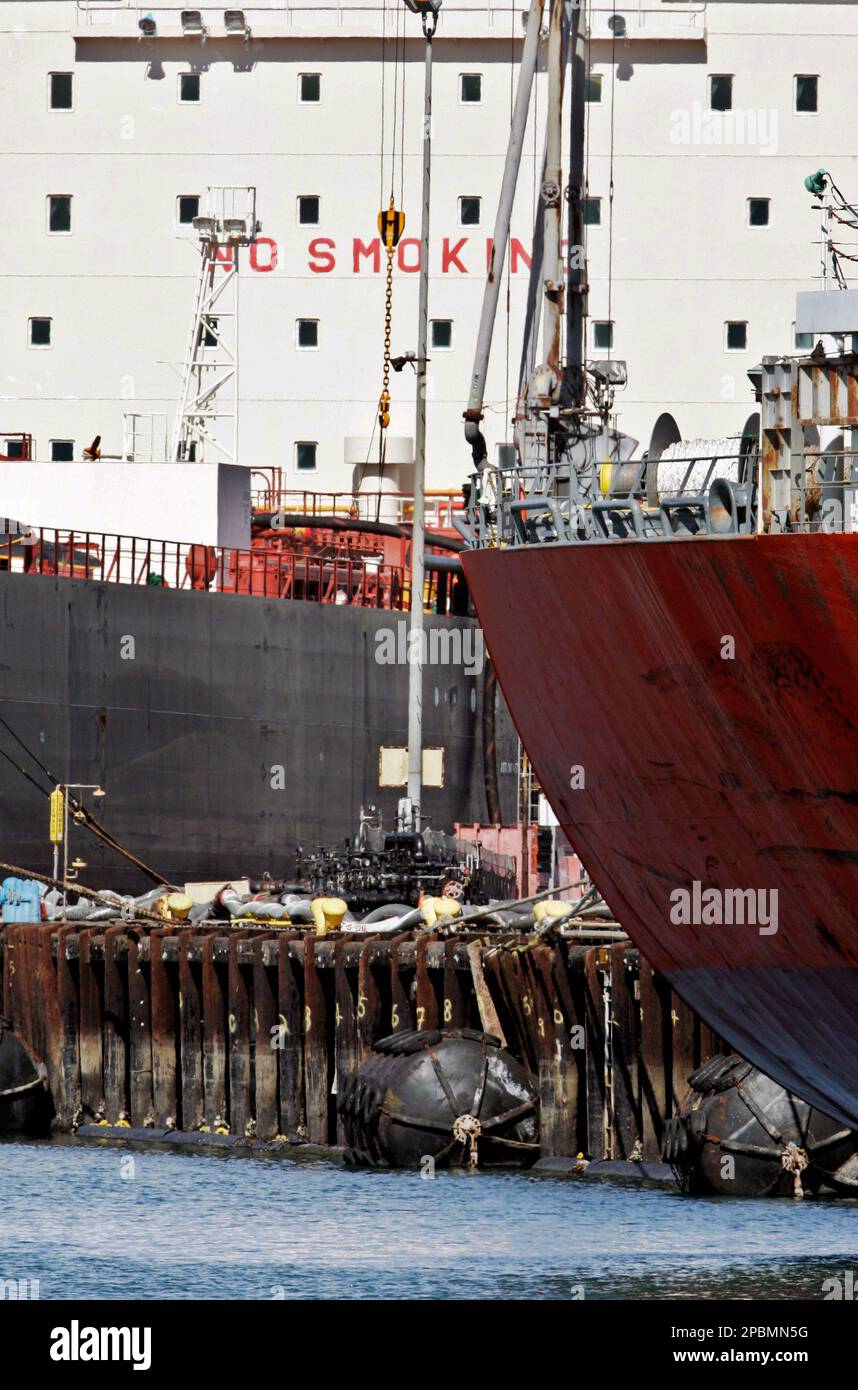 Oil tankers at a Valero oil terminal dwarf the piers they are tied to ...