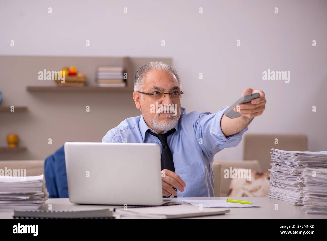 Old boss working from home during pandemic Stock Photo - Alamy