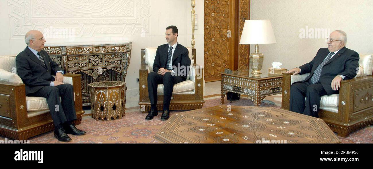 Syrian President Bashar al-Assad, centre, holds talks with Tunisian ...