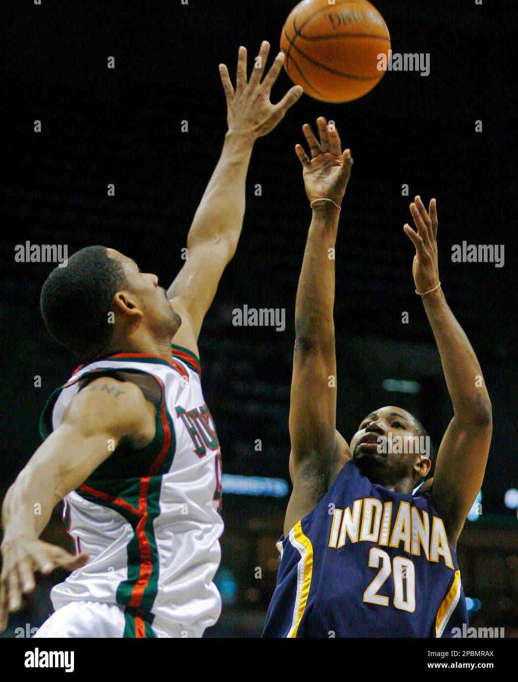 Milwaukee Bucks' Charlie Bell, left, tries to block a shot by Indiana ...