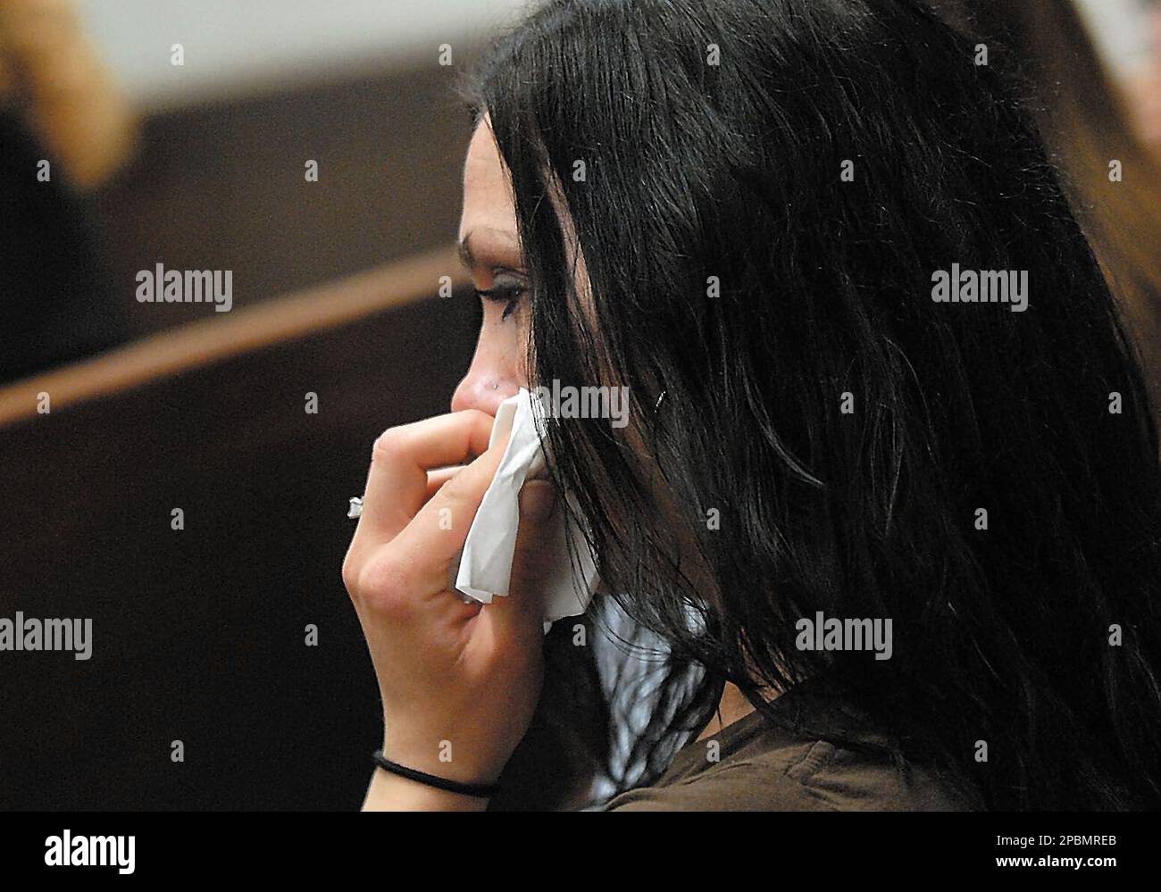 A loved one of Cassie Jo Stoddart reacts during the playing of the 911 ...