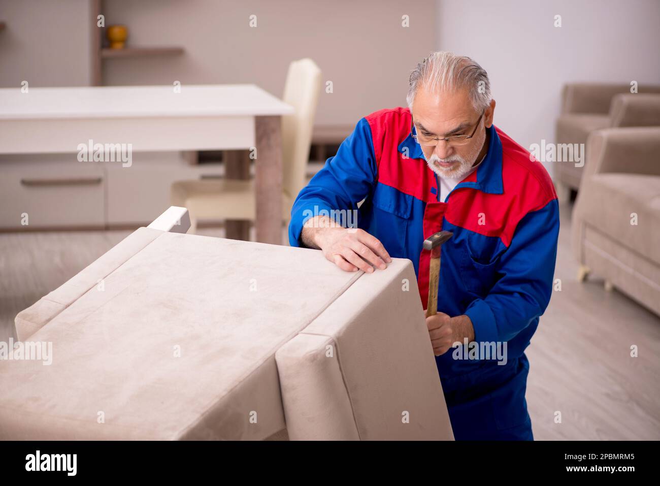 Old carpenter working at home Stock Photo - Alamy