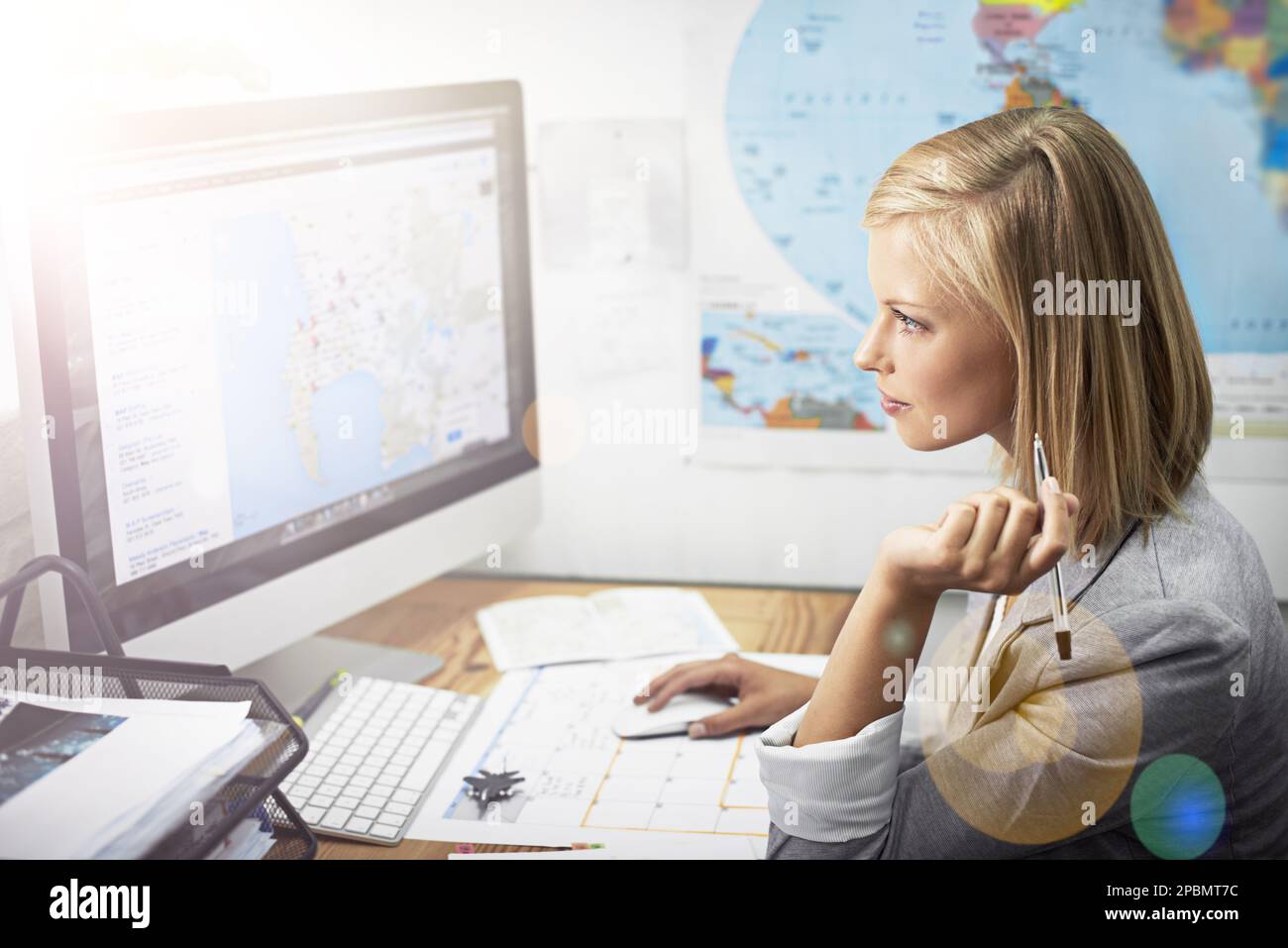 Planning perfect holidays for all of her clients. a young female travel ...