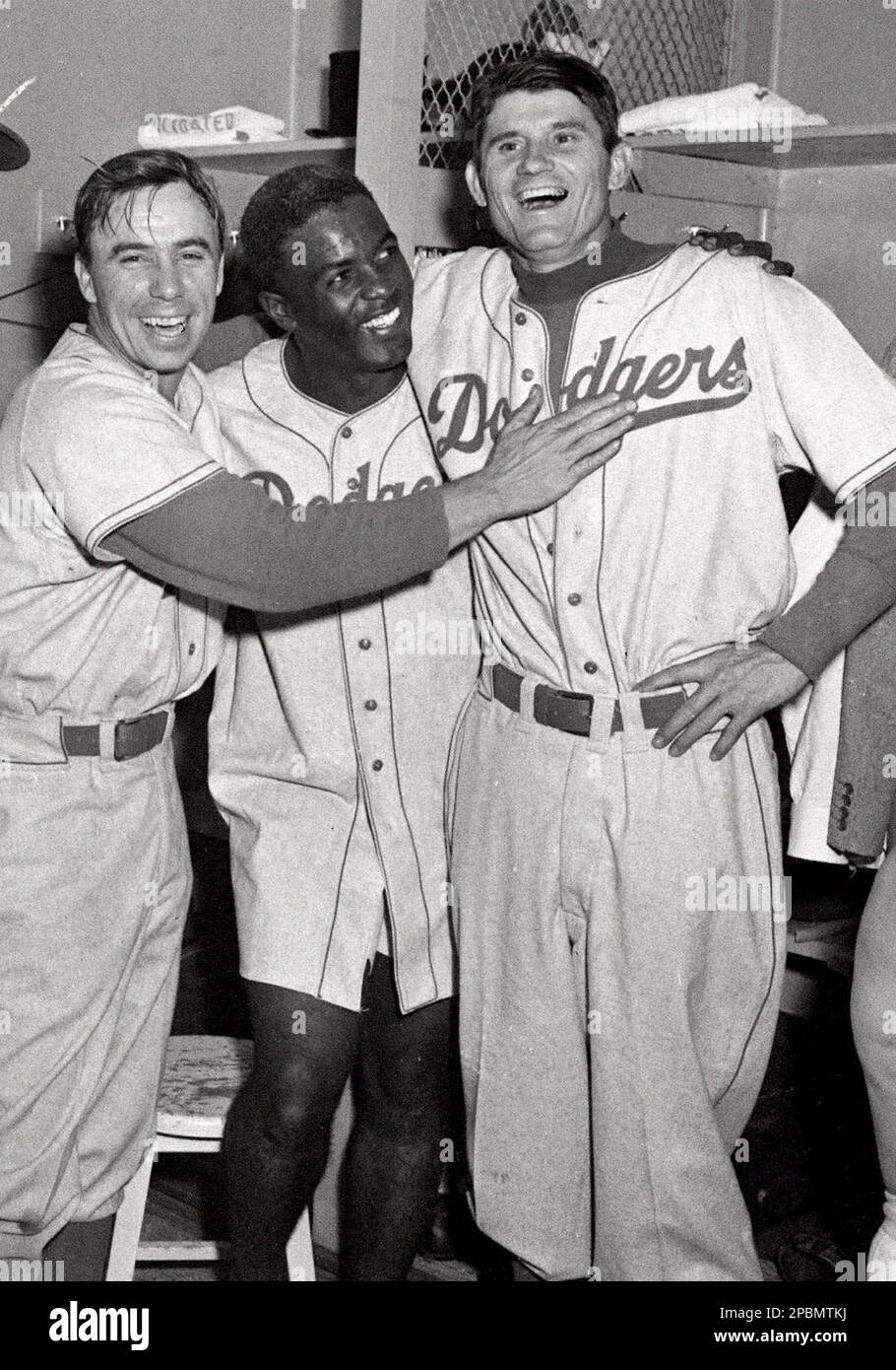 ** FILE ** Brooklyn Dodgers from left, Pee Wee Reese, Jackie Robinson ...