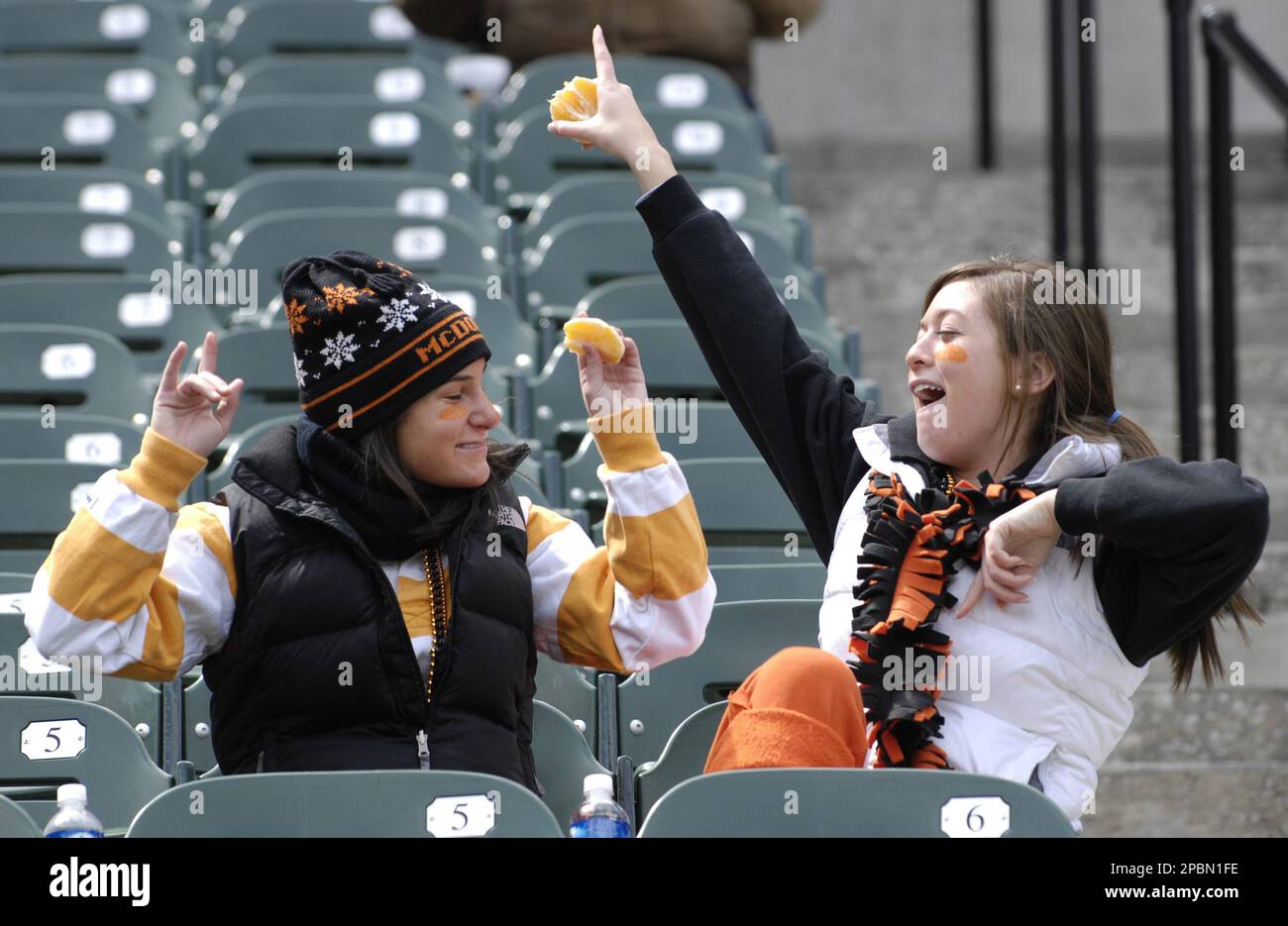 Baltimore Orioles' fans Nicki Berg, left, and Courtney LeBow cheer ...