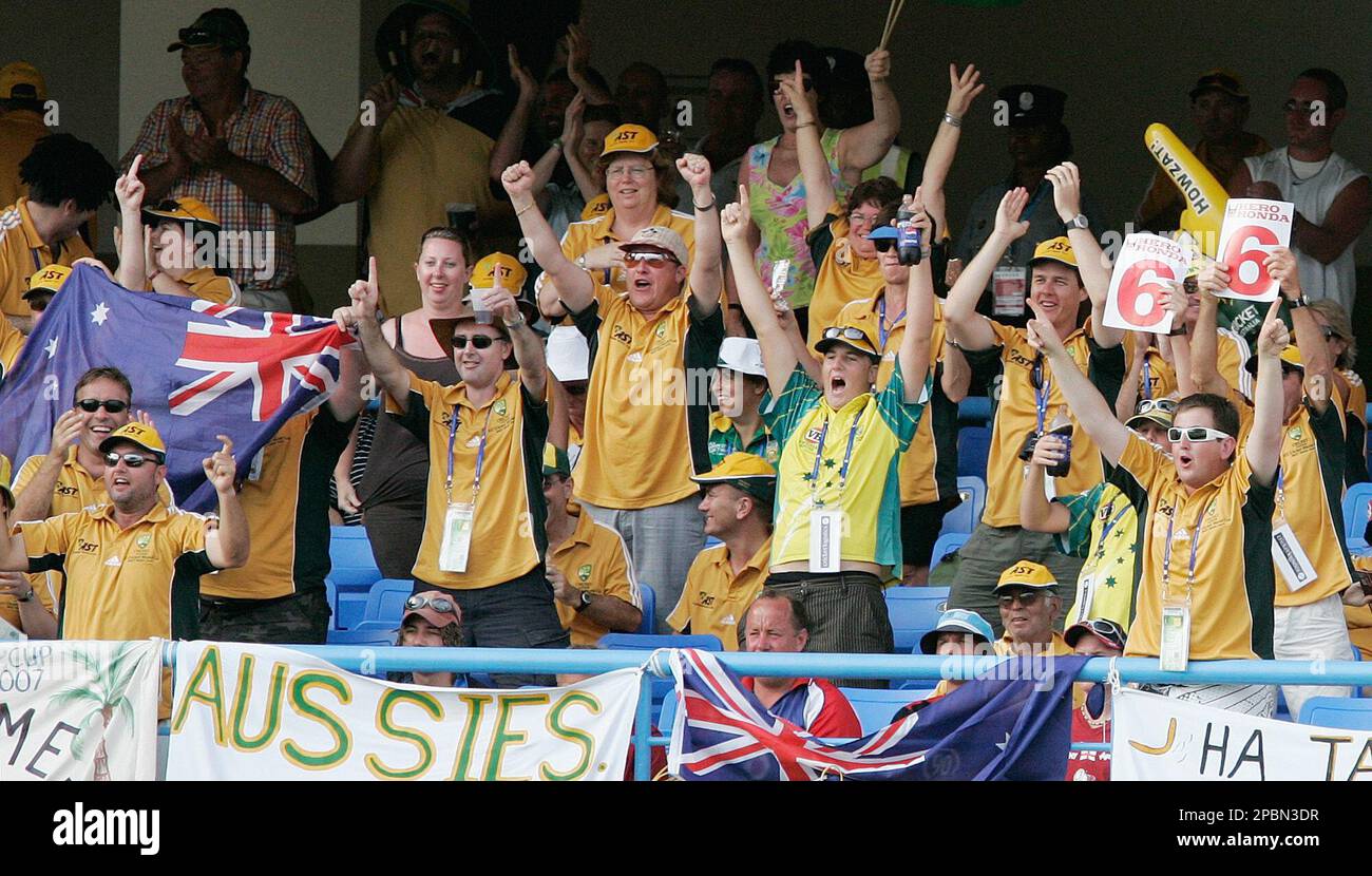 Australia's cricket fans celebrate a boundary shot by Andrew Symonds ...