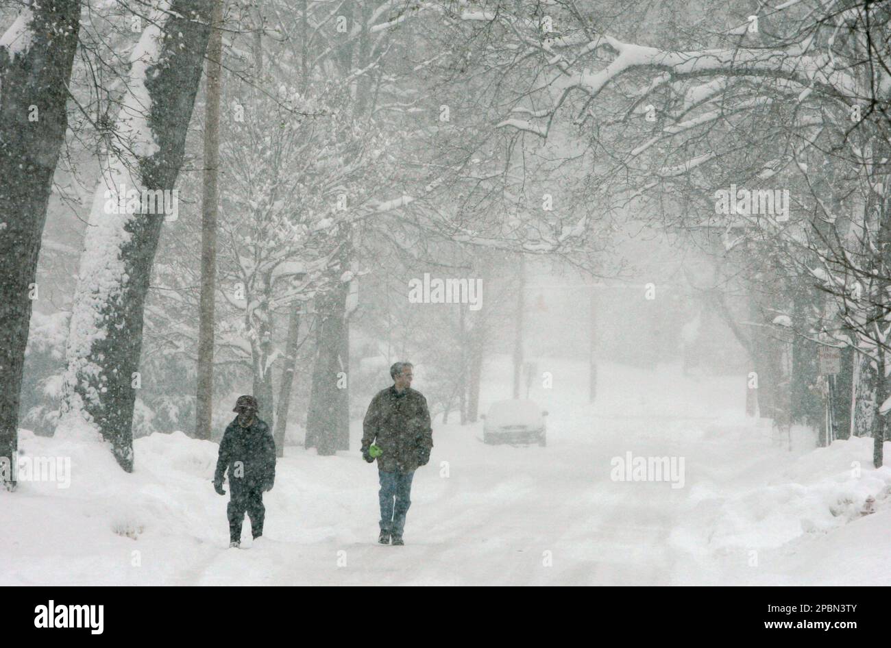 Noelle and Paul Schoenhagen take a morning walk after buying a loaf of ...