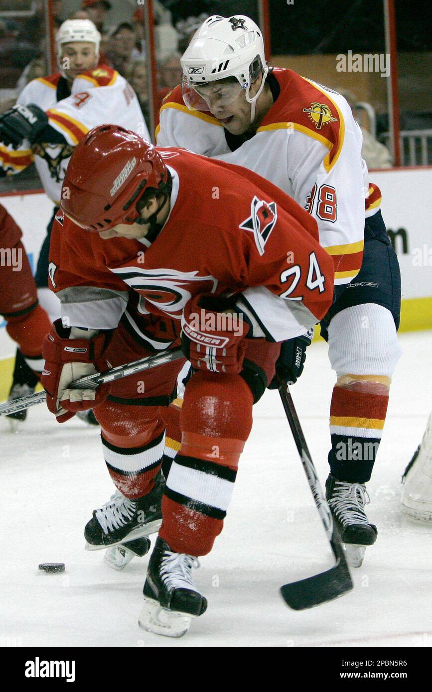 Florida Panthers' Janis Sprukts, right, and Carolina Hurricanes' Scott ...