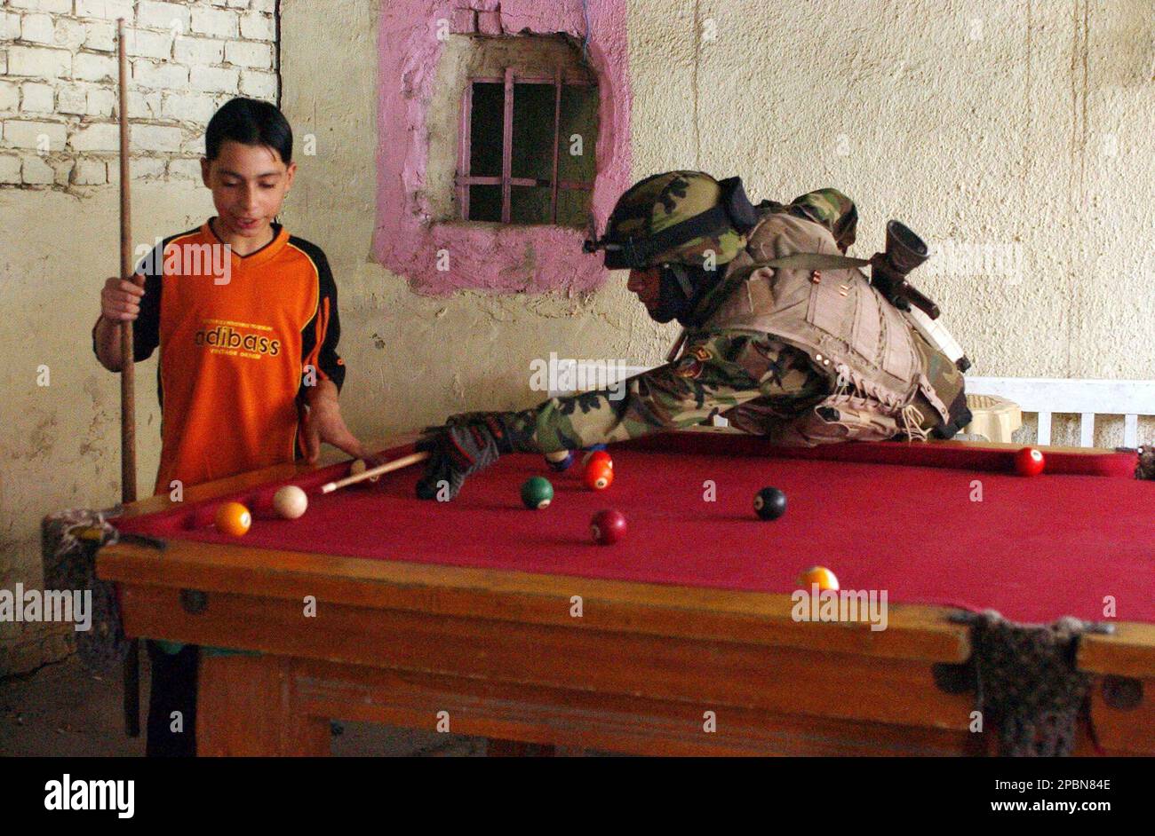 In this image released by the US Army, a policeman with the 5th Brigade ...