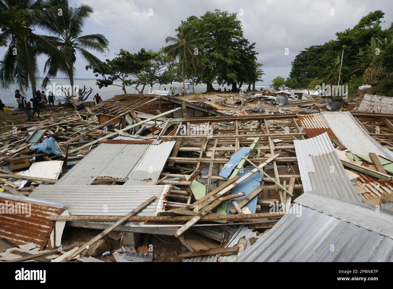 Destroyed homes lay in ruins after a tsunami struck the coast, in Gizo ...