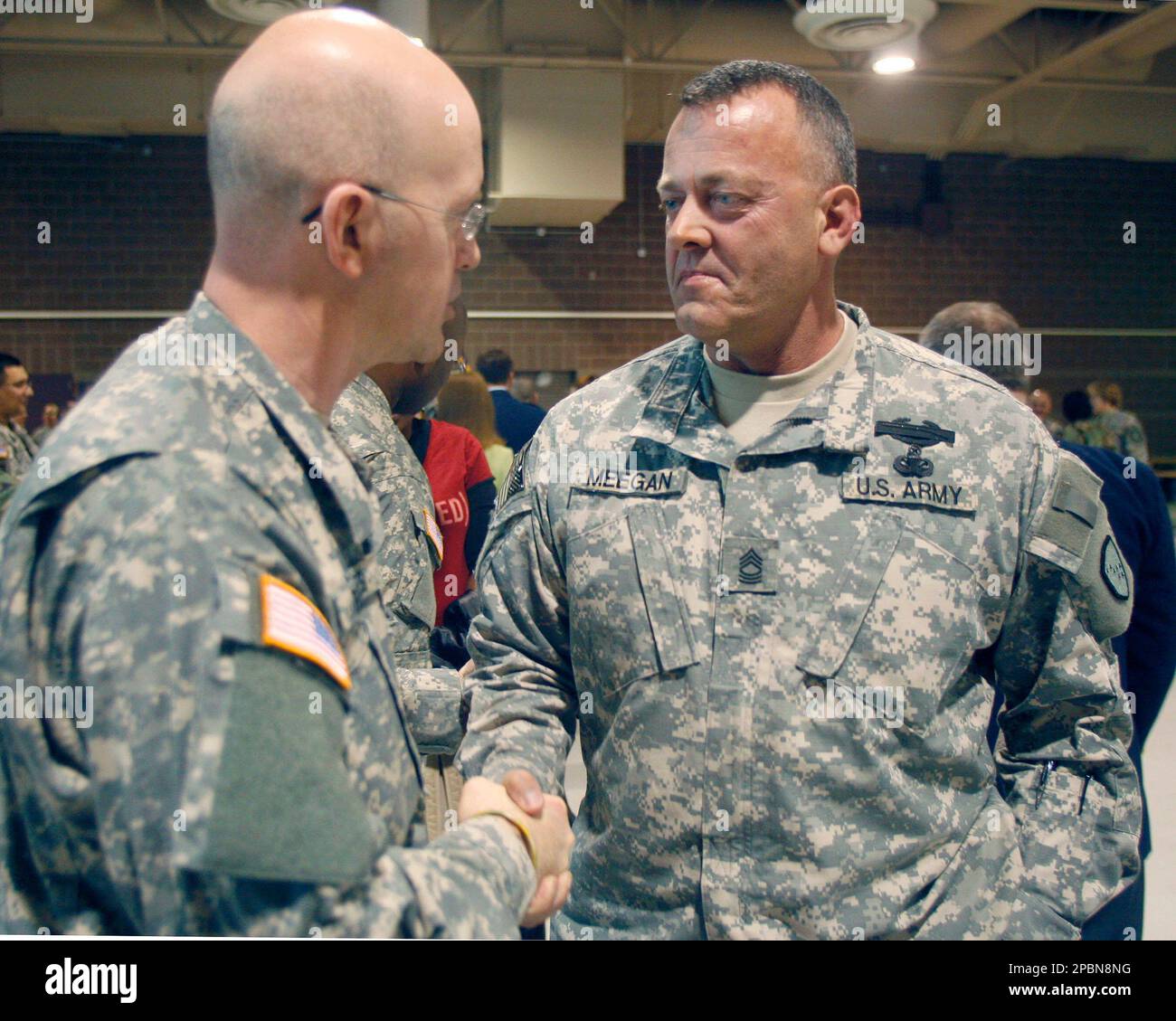 Col. Mike Bridges, deputy commander of the 207th Infantry Brigade, left ...