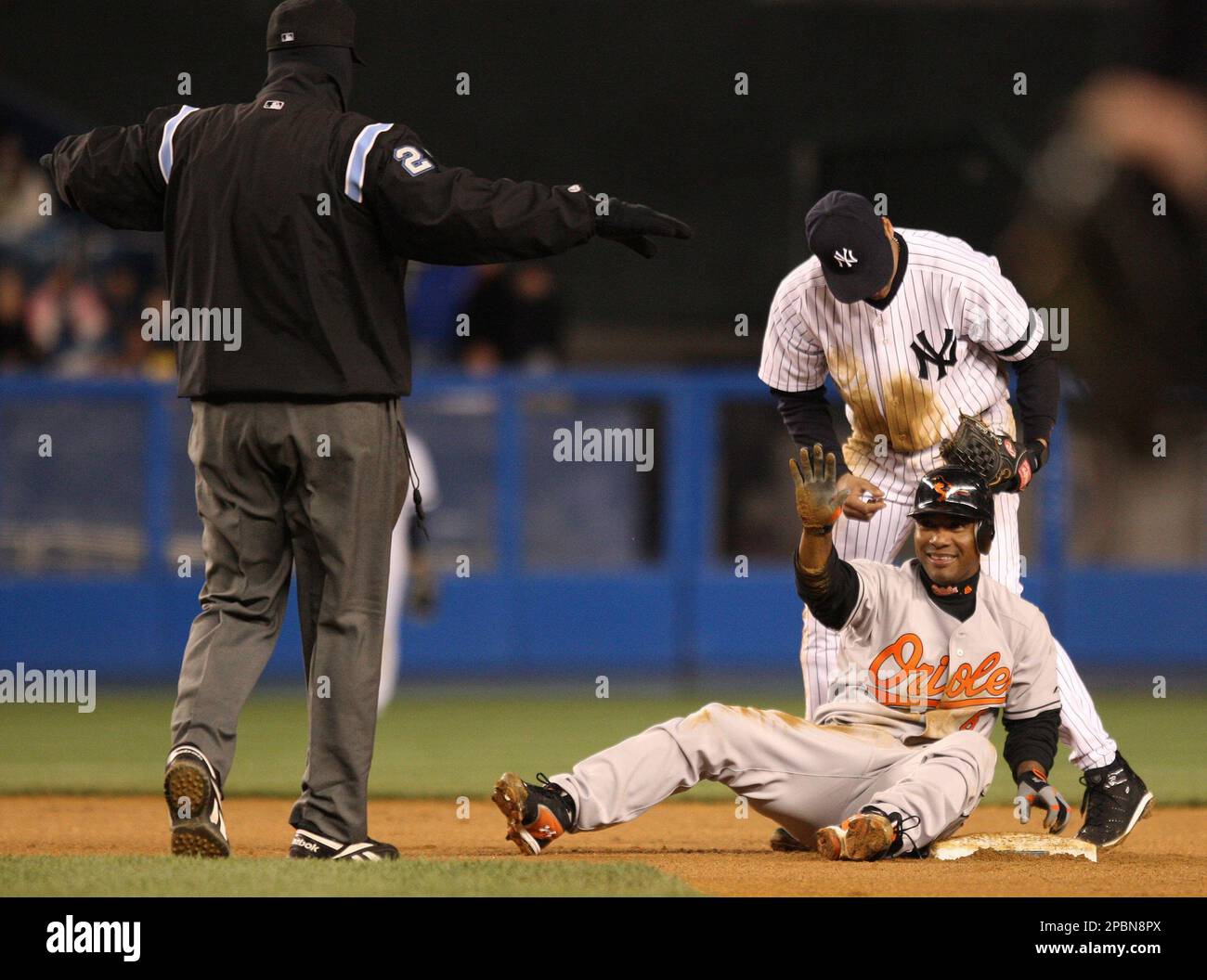 Baltimore Orioles' Melvin Mora looks to umpire Jerry Layne for time ...