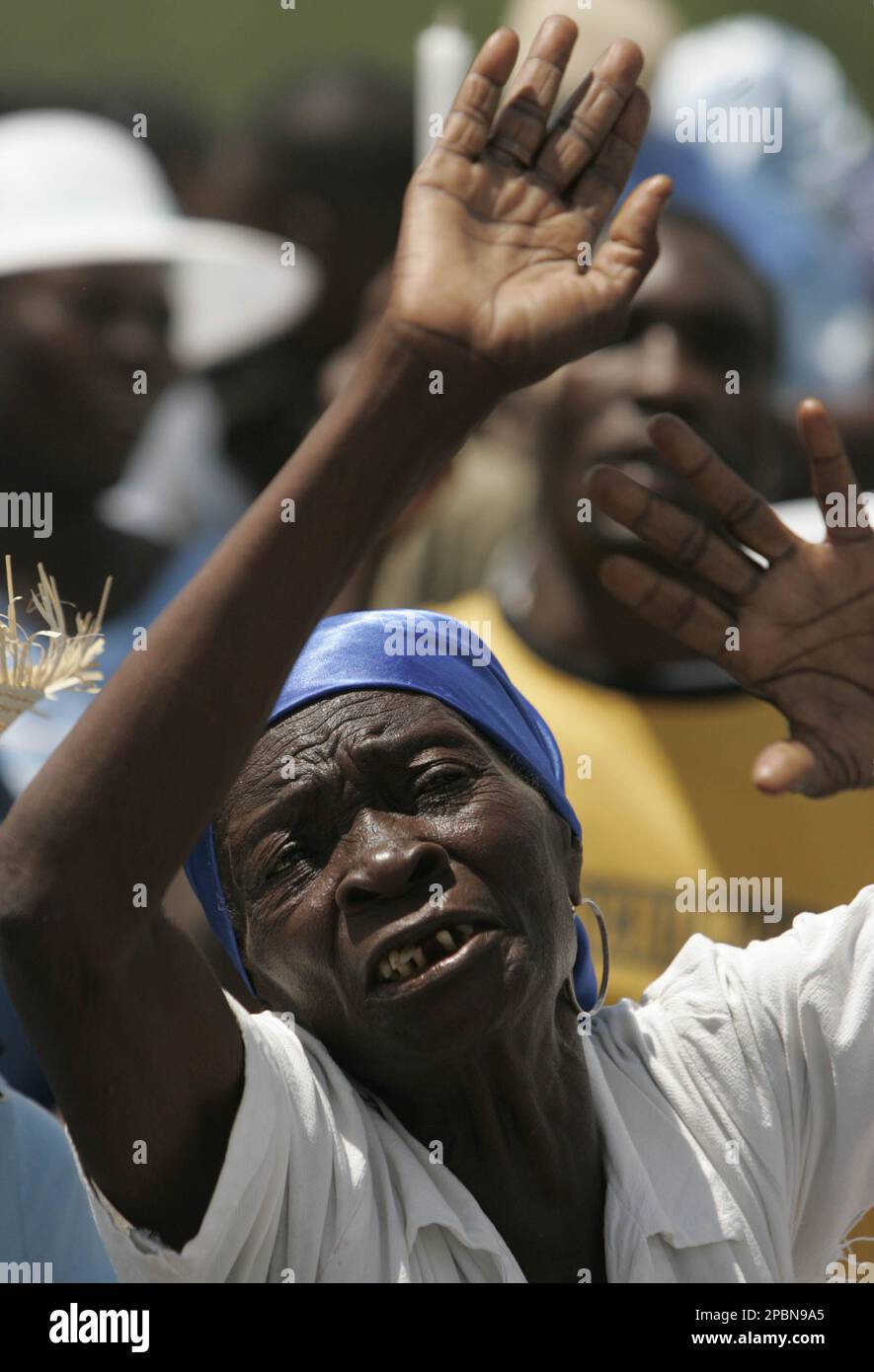 A woman prays during a pilgrimage to the mount of Calvaire Miracle in ...