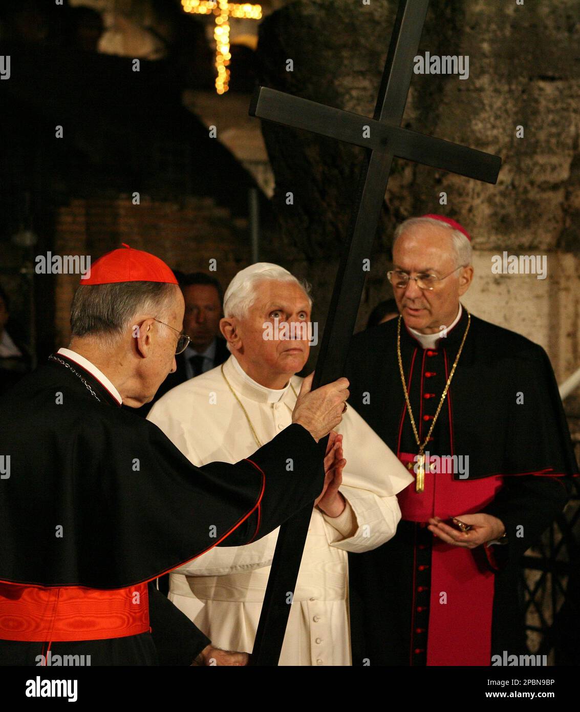 Pope Benedict XVI is given a wooden cross by Cardinal Camillo Ruini ...