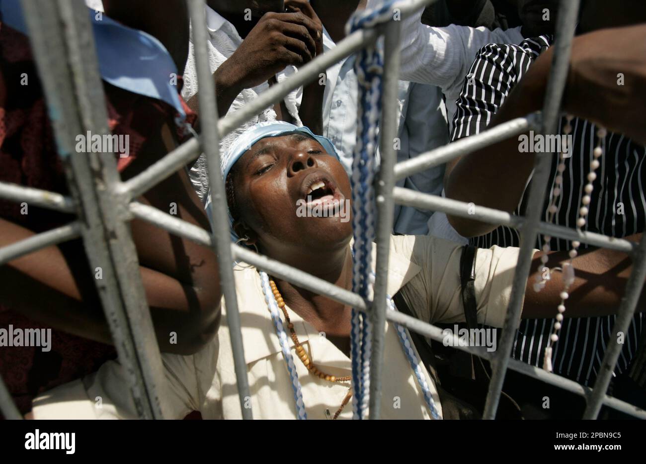 A woman prays during a pilgrimage to the mount of Calvaire Miracle in ...