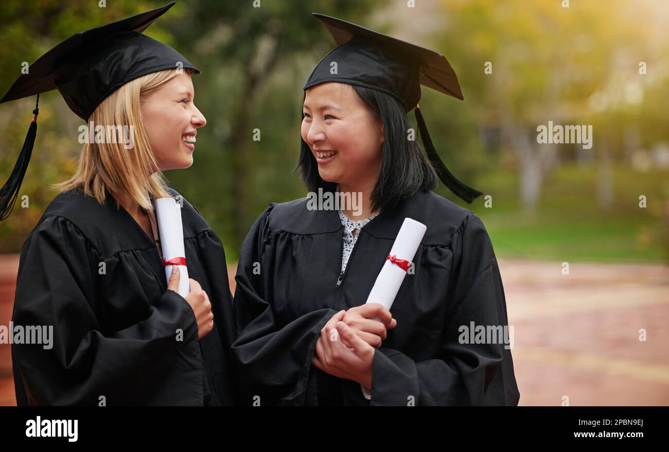 Theyre destined for great things. two college graduates holding their ...
