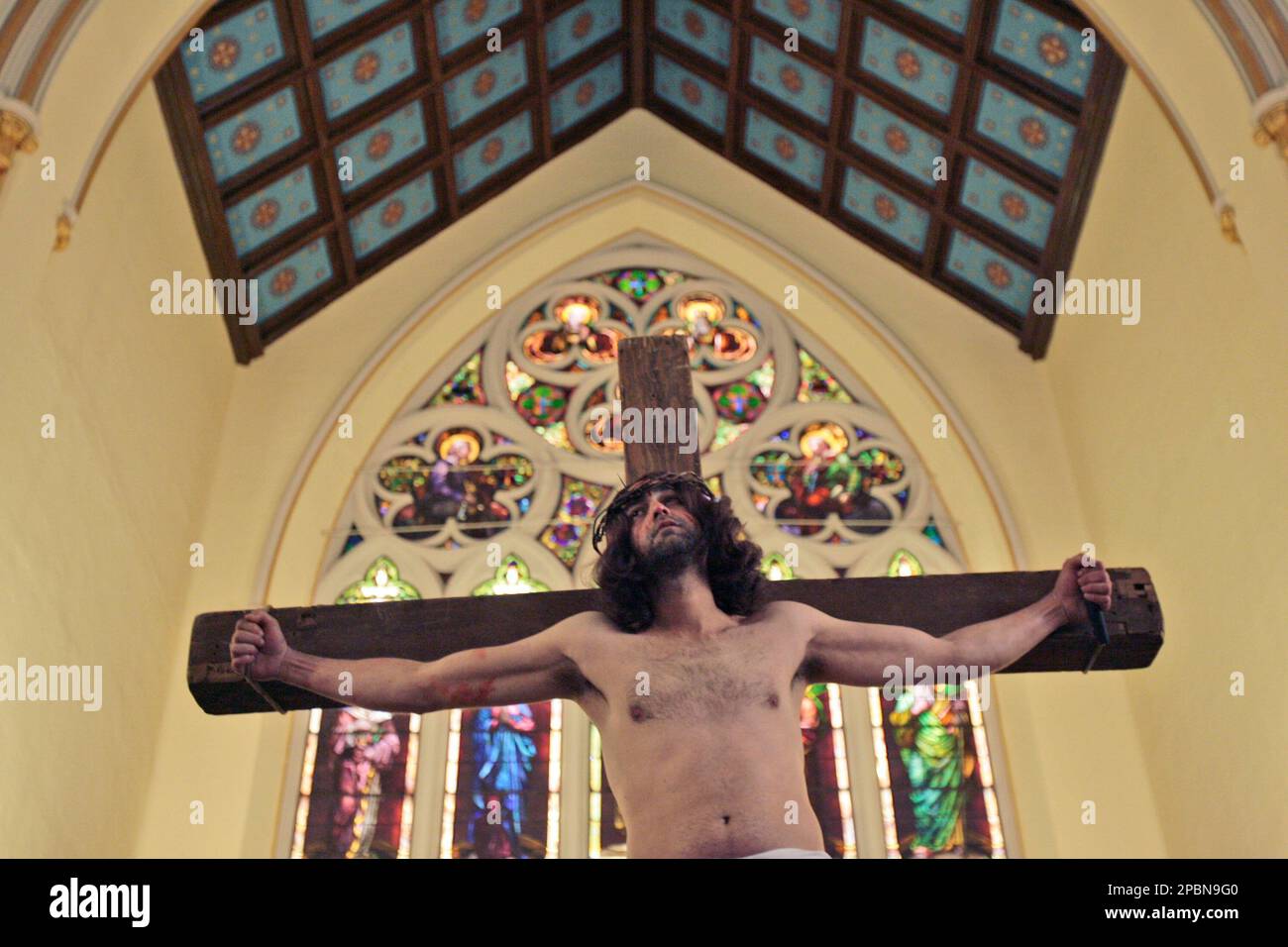 Jesus Christ, played by Rafael N. Gonzalez, hangs from the cross during ...
