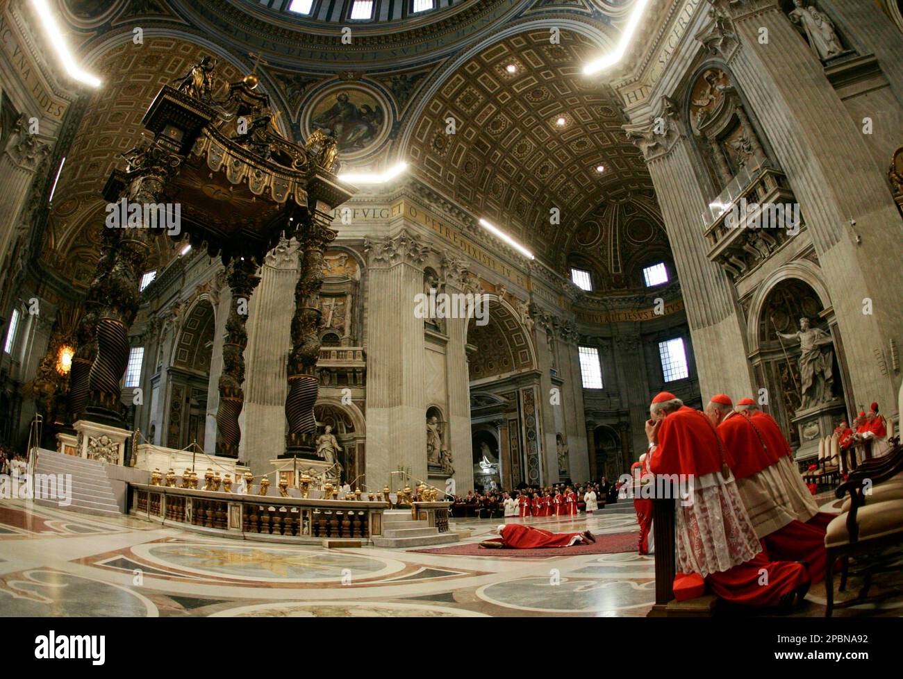 Cardinals kneel in prayer as Pope Benedict XVI lies on the ground ...
