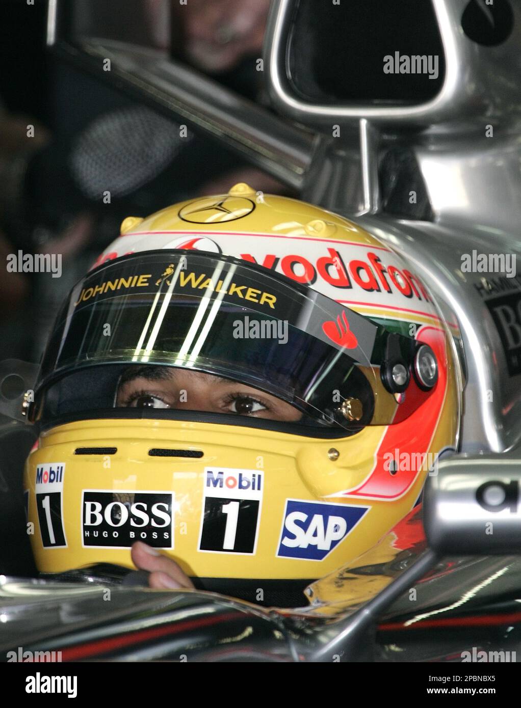 Britain's Lewis Hamilton sitting in the cockpit of his McLaren-Mercedes ...