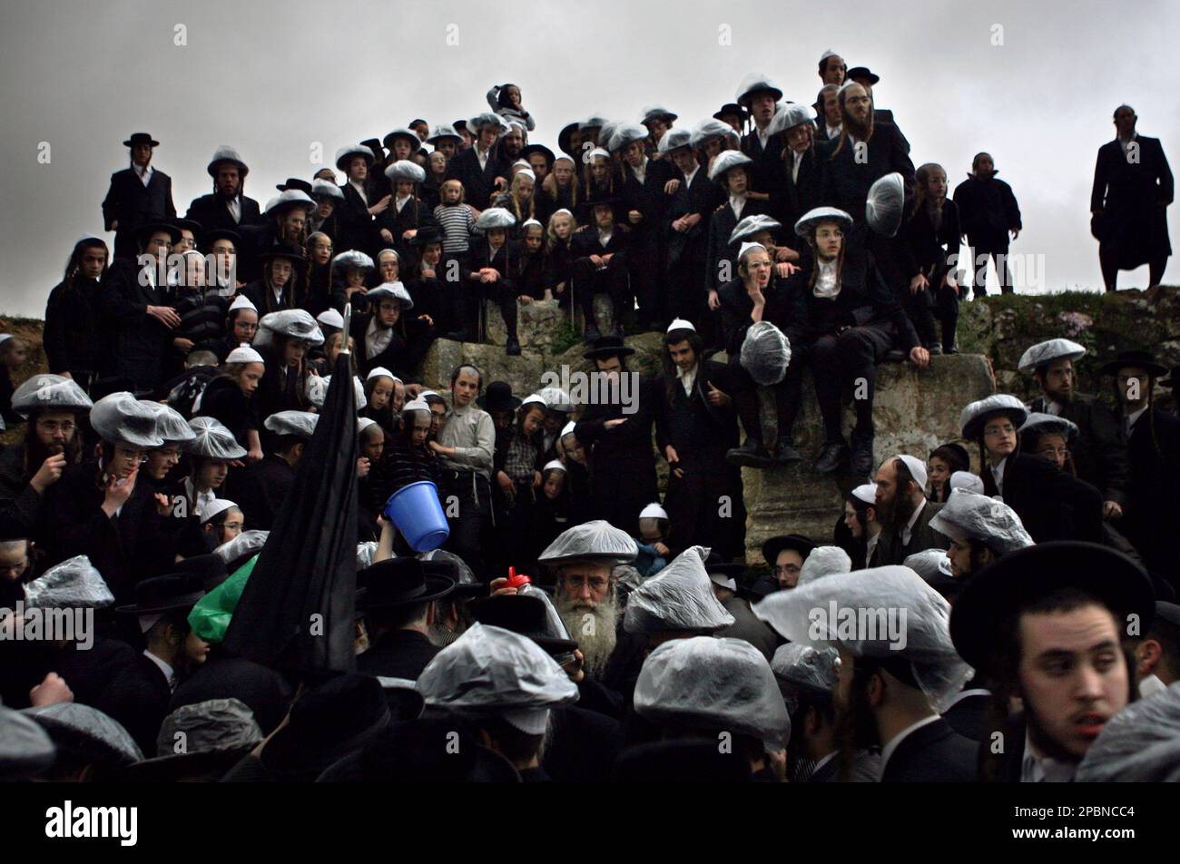 Ultra-Orthodox Jews from the Hasidic group of Teldot Aharon stand in ...