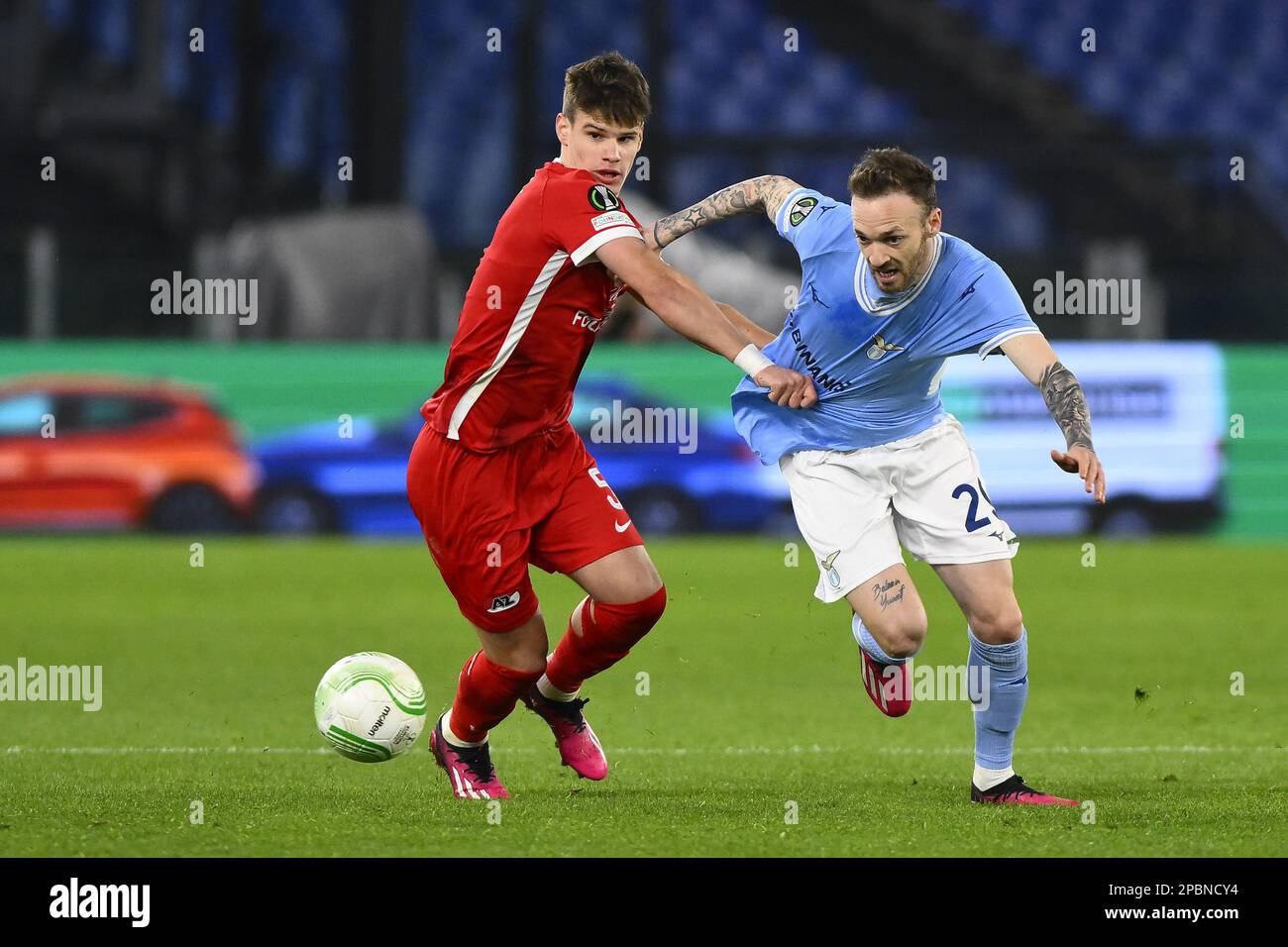 Manuel Lazzari of S.S. LAZIO and Milos Kerkez of AZ Alkmaar during the first leg of the round of ...