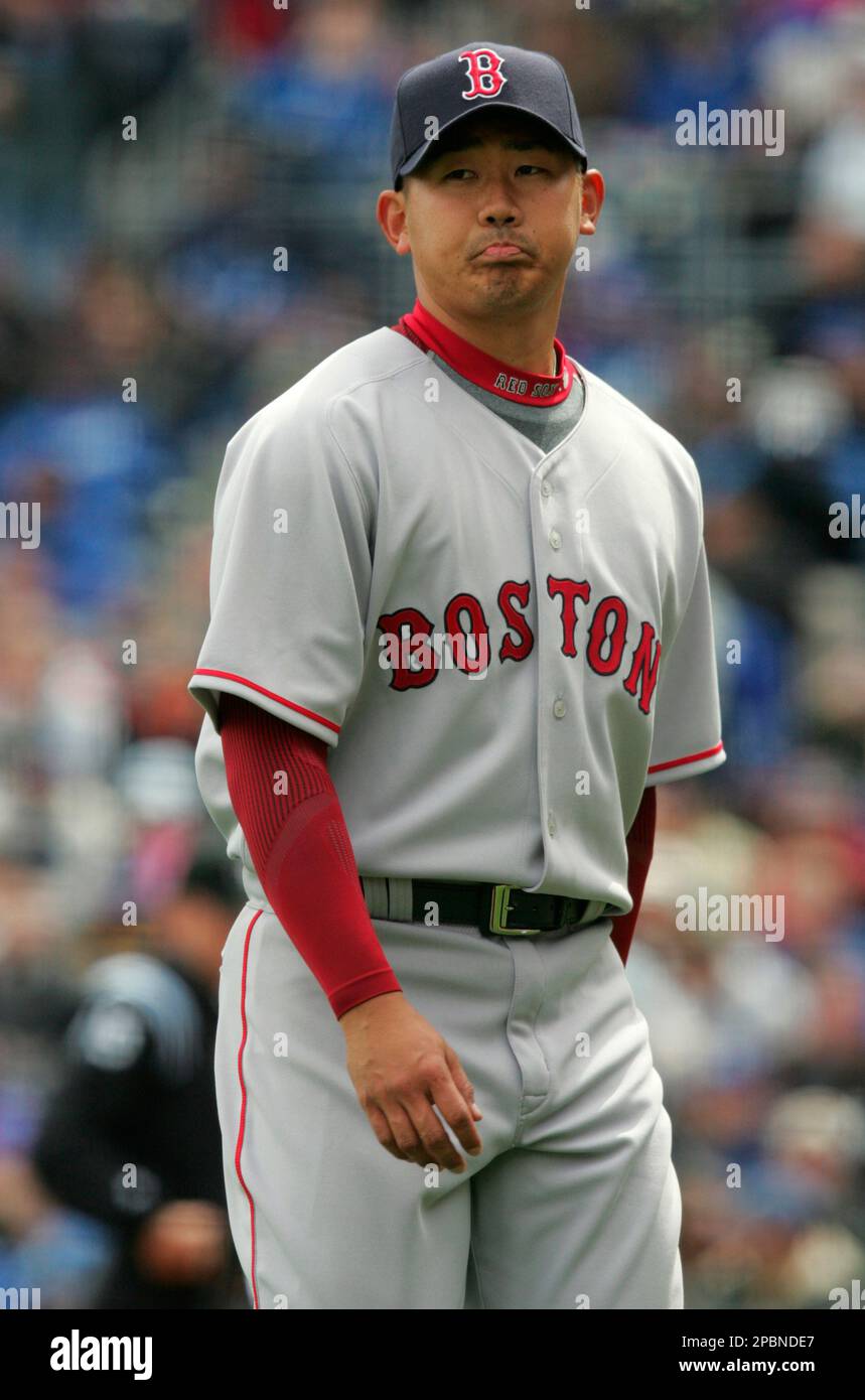 Boston Red Sox pitcher Daisuke Matsuzaka walks to the dugout following ...