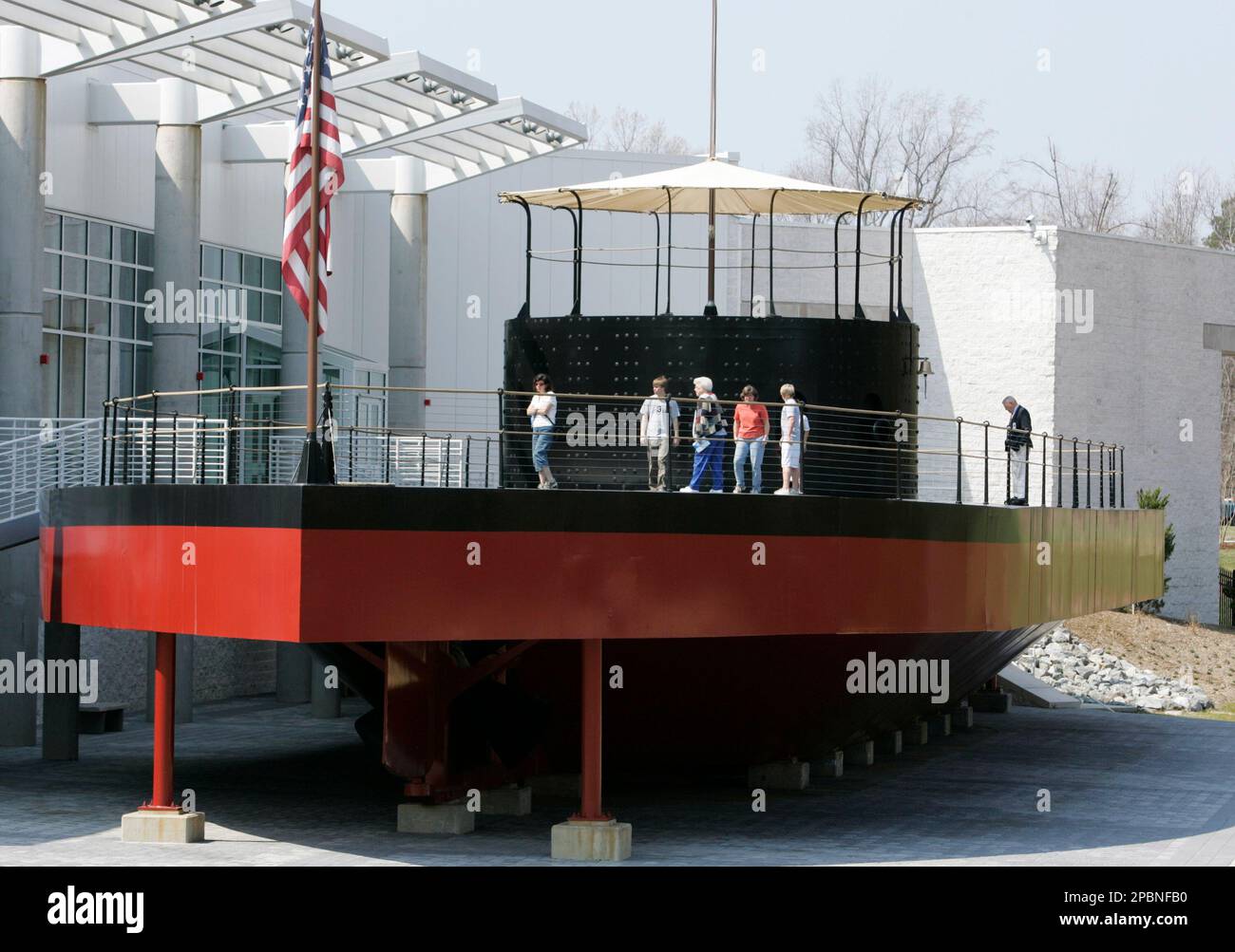 ** FOR IMMEDIATE RELEASE **Visitors at the USS Monitor Center walk on ...