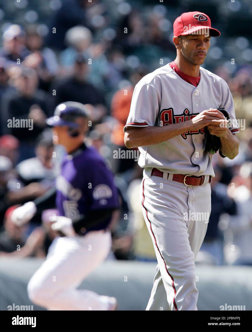Arizona Diamondbacks pitcher Juan Cruz hangs his head as Colorado ...